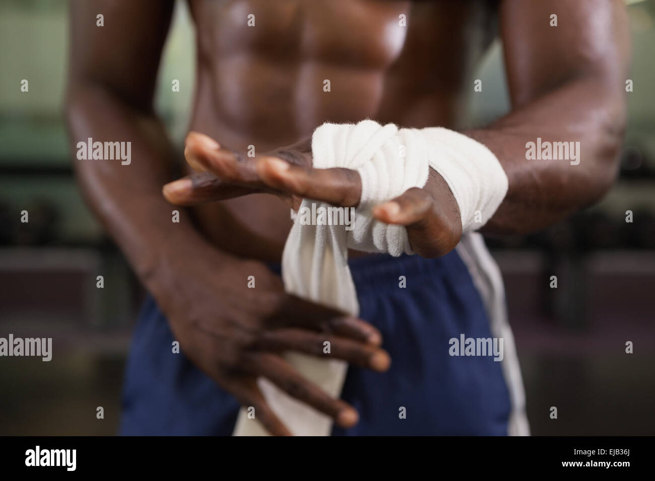 Muscular man binds bandage on his hand Stock Photo - Alamy