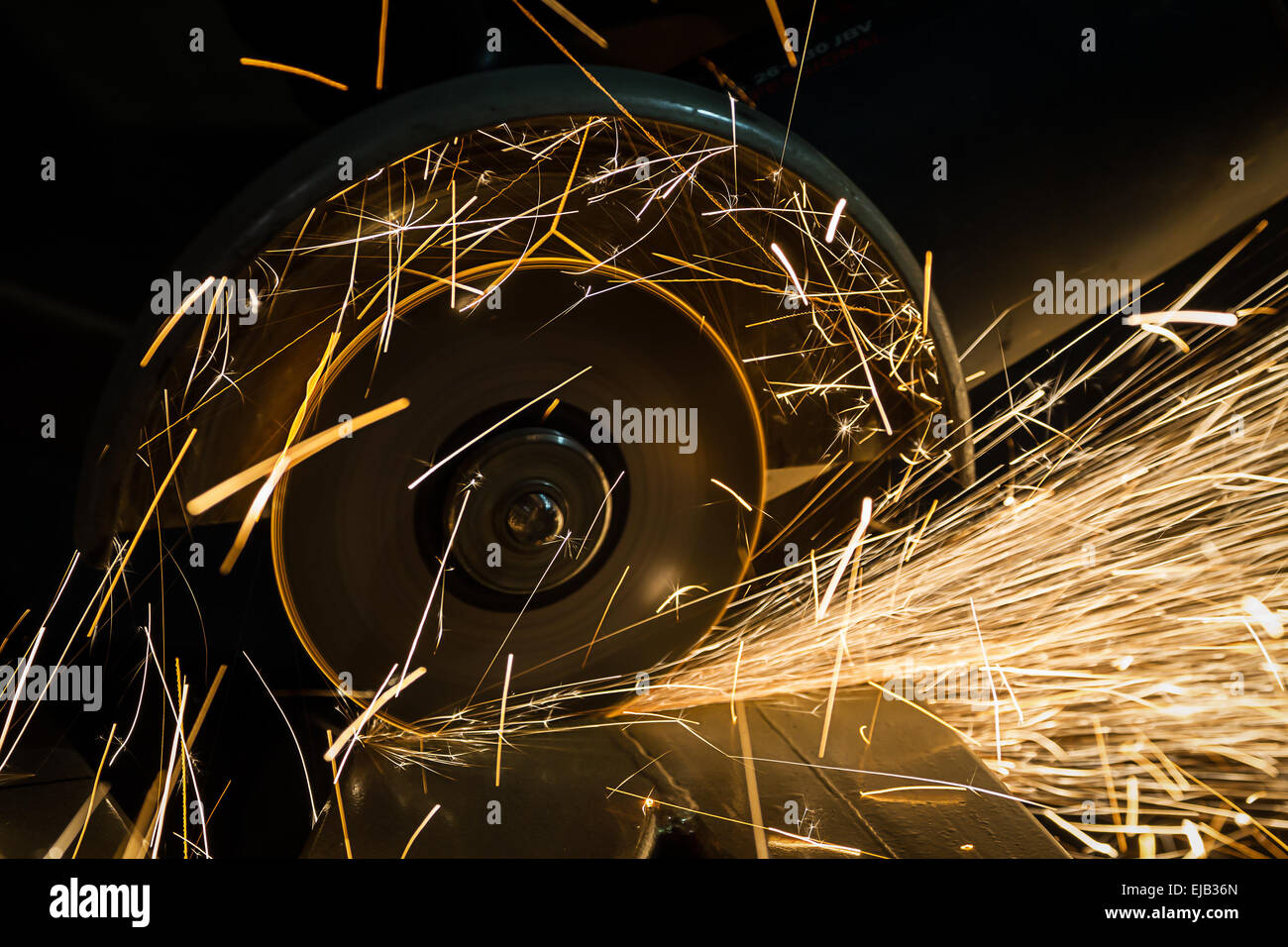 sharpening and cutting of iron by abrasive disk machin Stock Photo - Alamy