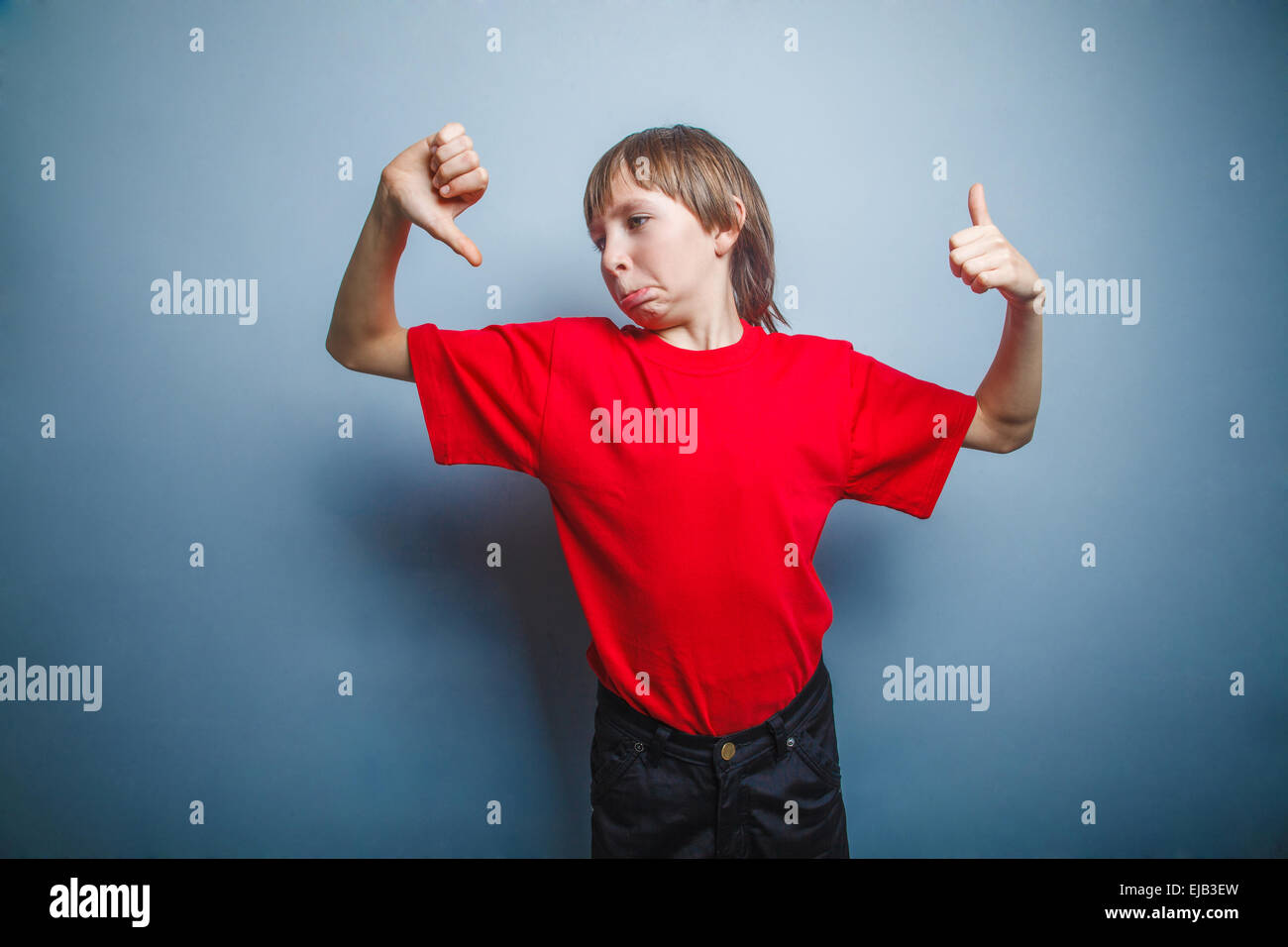 Boy, teenager, twelve years in red shirt showing sign of Yes Stock ...