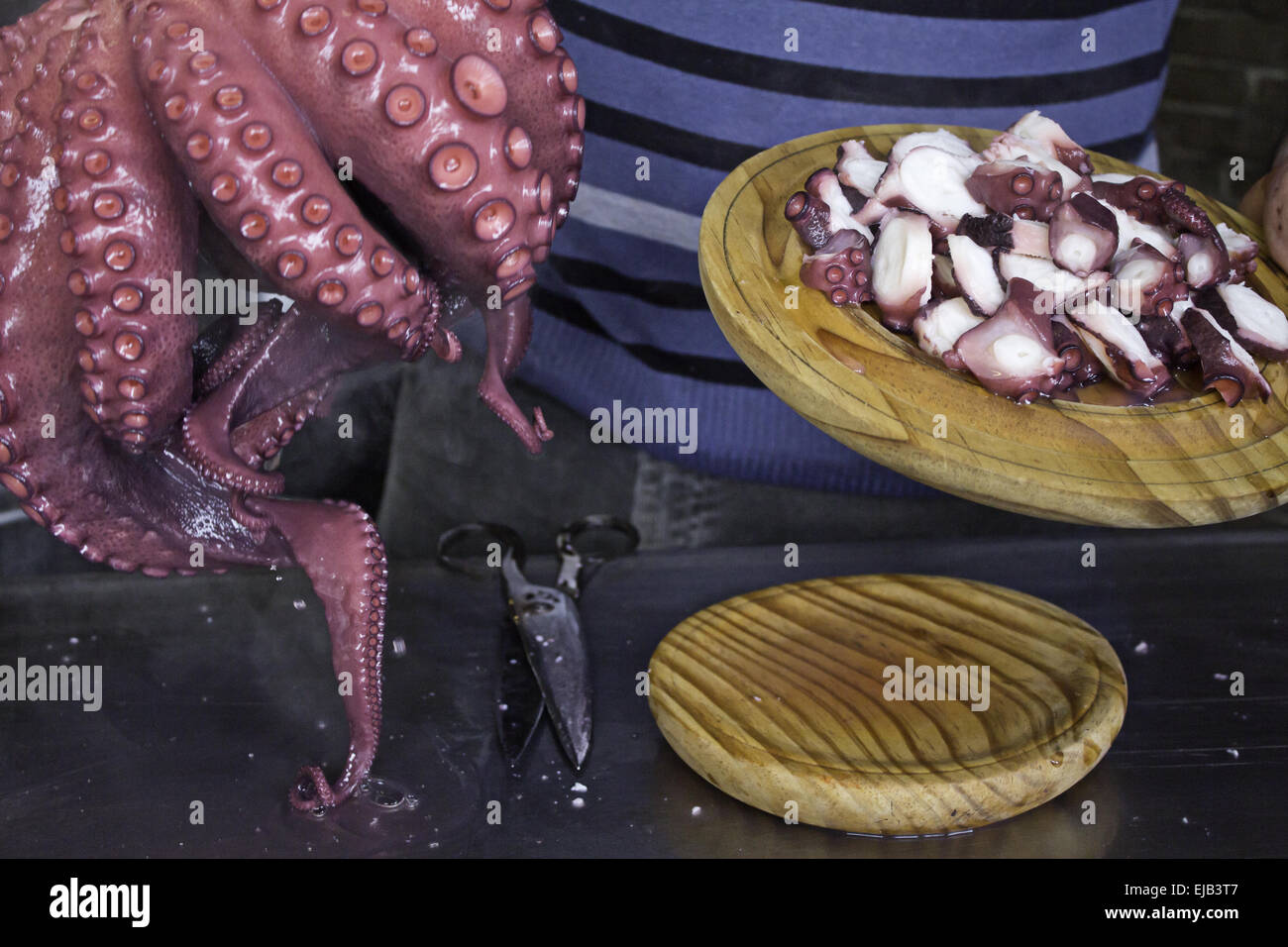Cooking octopus in restaurant hospitality, food and business Stock ...