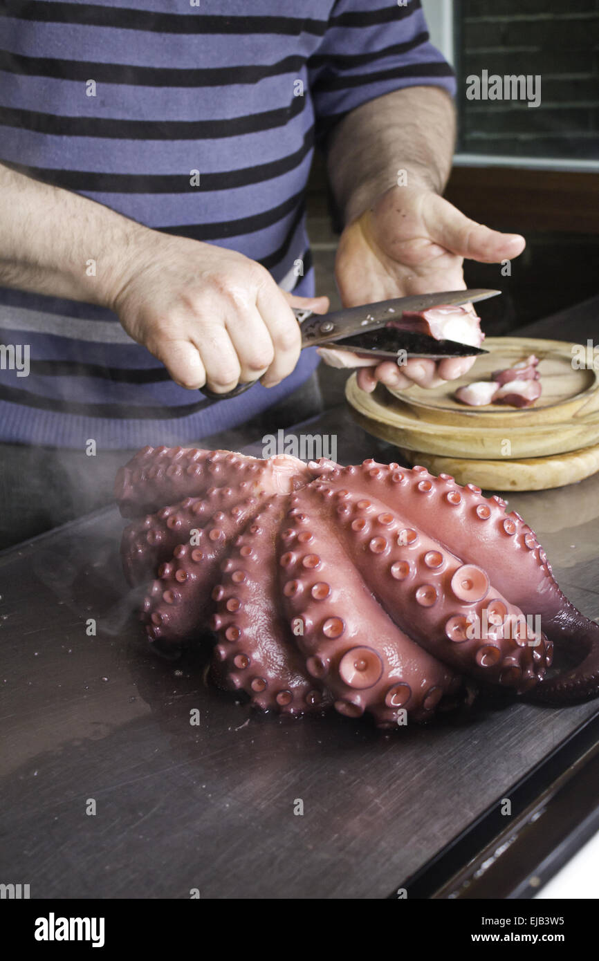 Cooking octopus in restaurant hospitality, food and business Stock ...