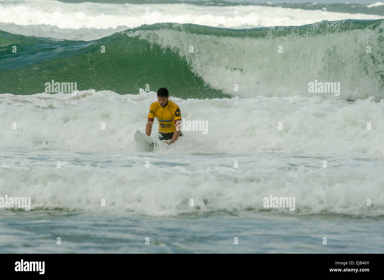 Waves crashing around a pro surfer in the sea at the Boardmasters surf ...