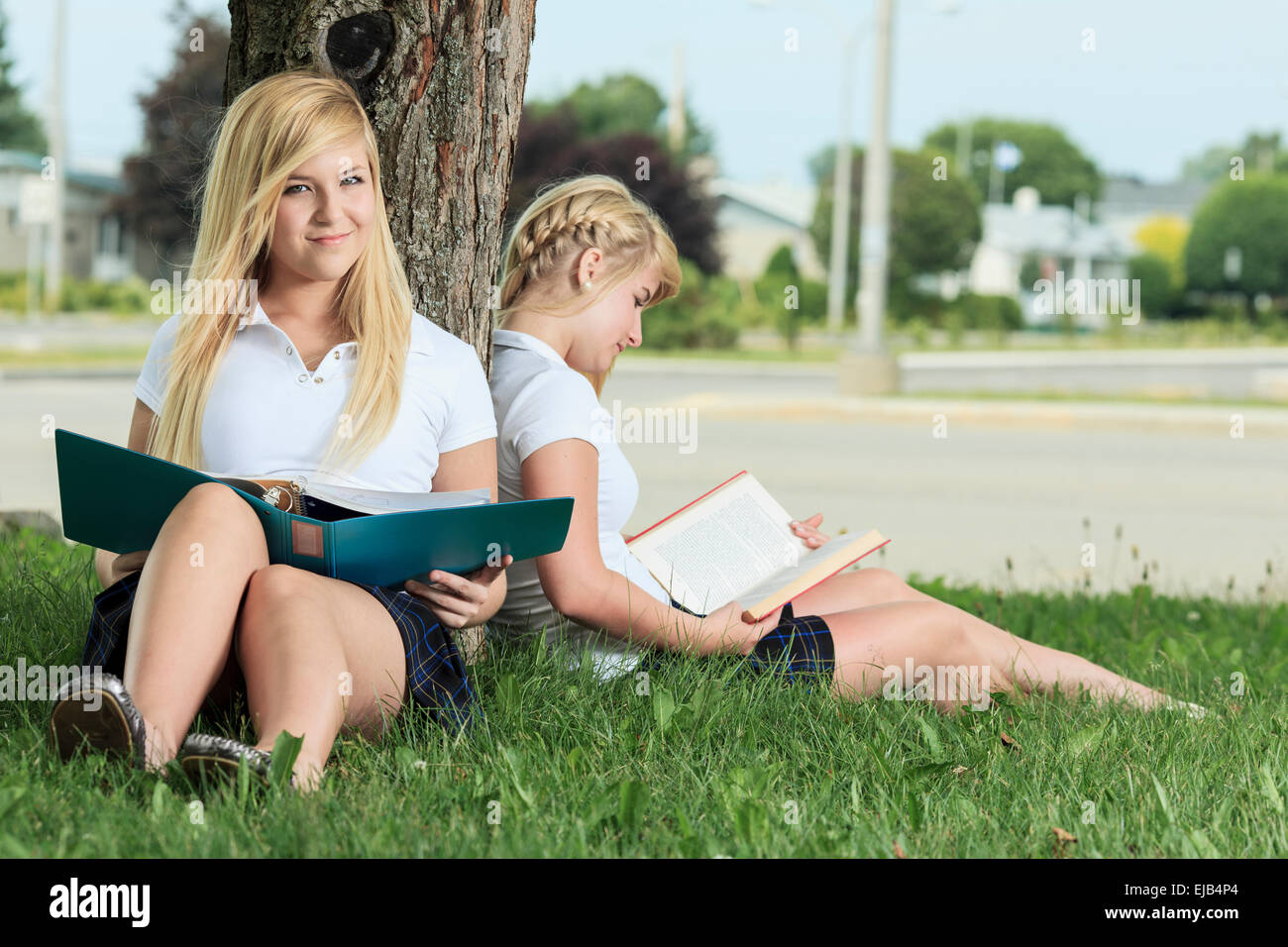Two teenage girls having fun outdoors Stock Photo - Alamy