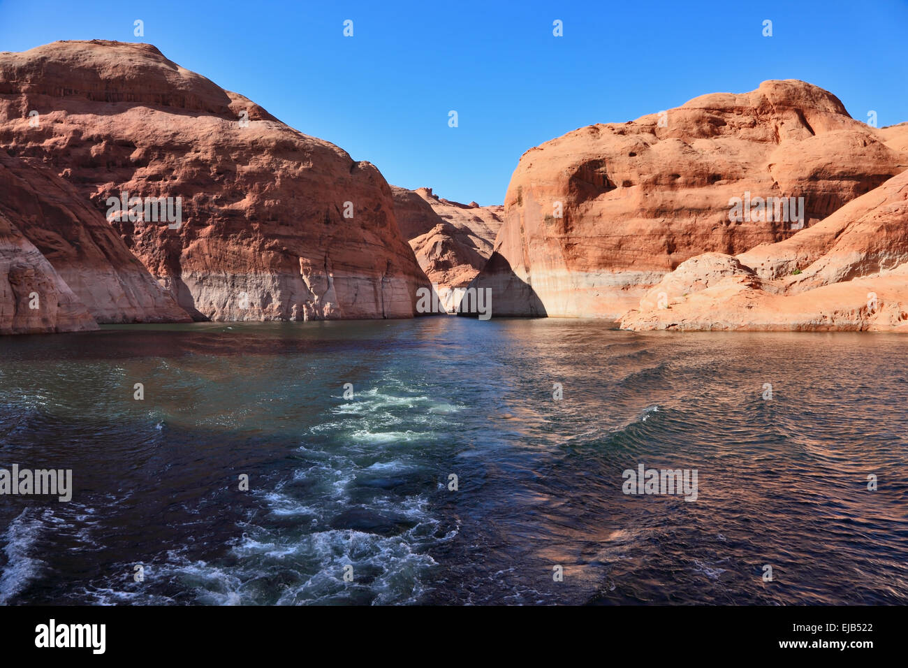 Lakeside in red sandstone covered sunset Stock Photo - Alamy