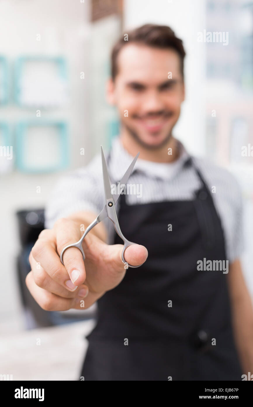 Happy man holding scissors hi-res stock photography and images - Alamy