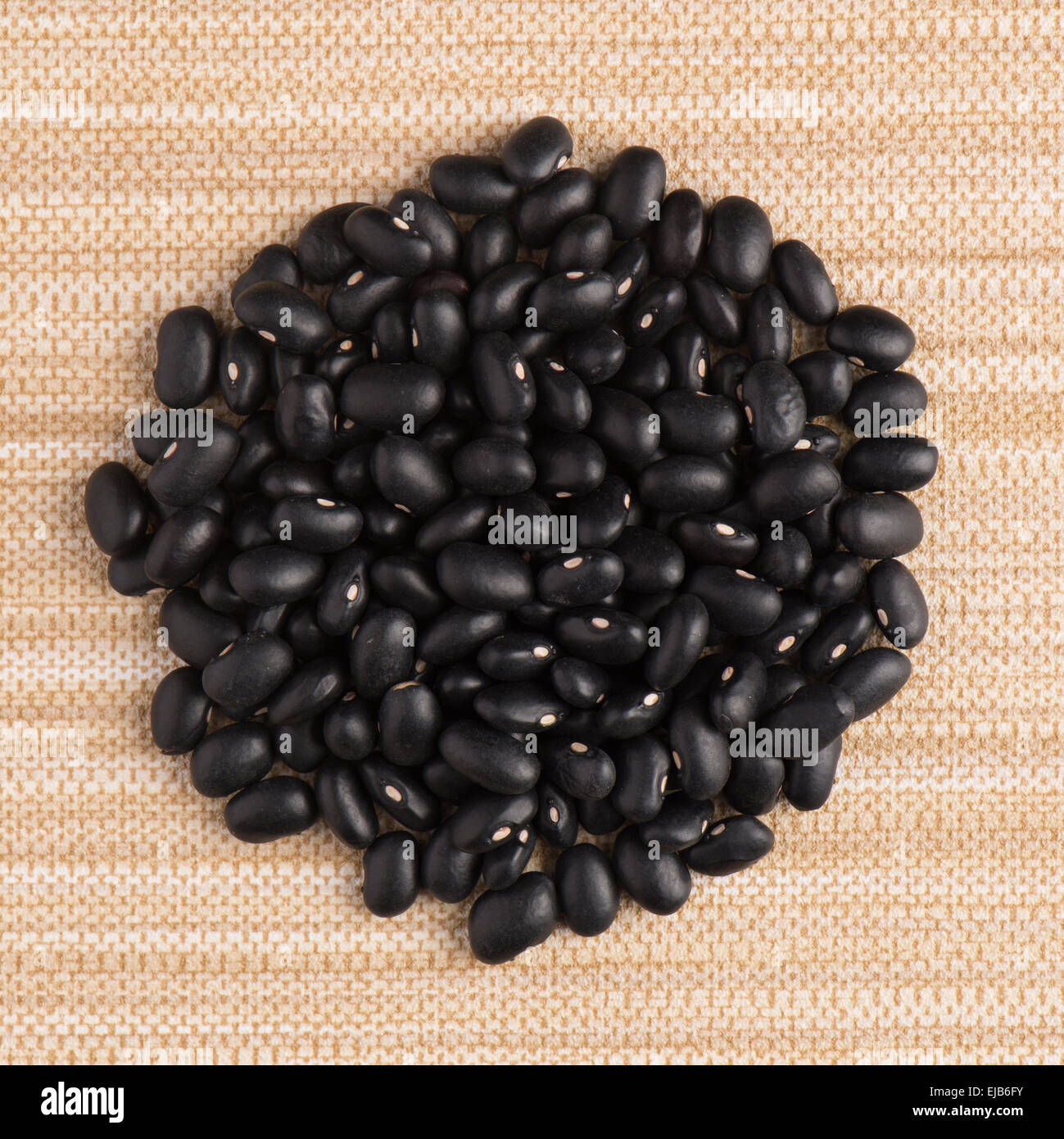 Circle of red beans on beige vinyl background Stock Photo - Alamy