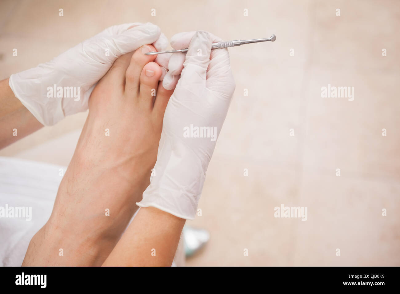 Customers toe nails getting cleaned Stock Photo - Alamy
