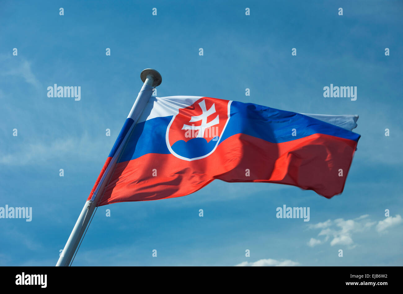 SLOVAKIAN FLAG FLYING ON FLAGPOLE Stock Photo - Alamy