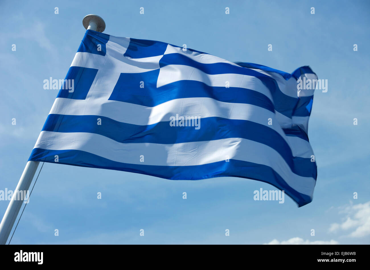 GREEK FLAG FLYING ON FLAGPOLE Stock Photo - Alamy