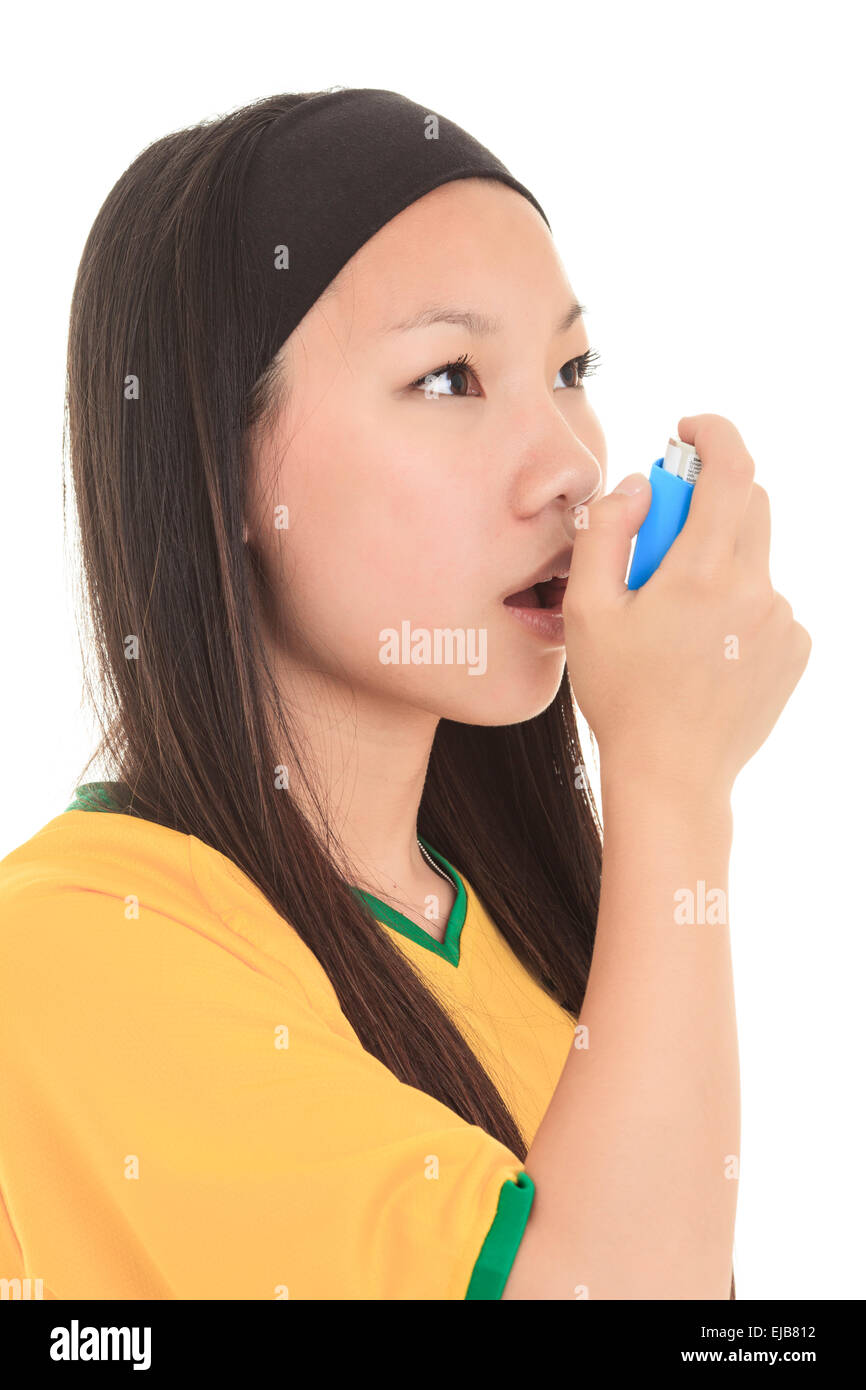 Close up image of a young woman using inhaler for asthma. White ...