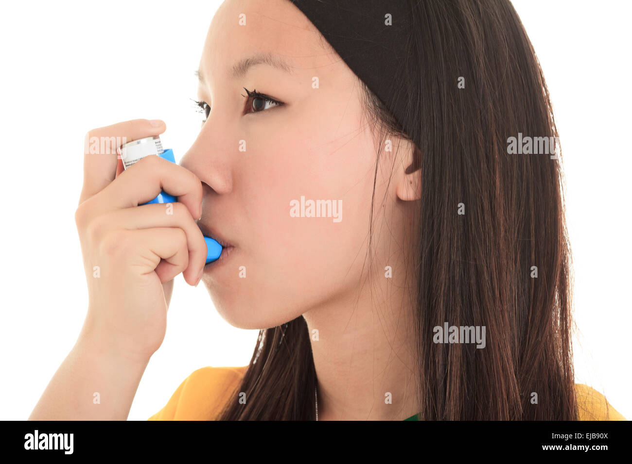 Close up image of a young woman using inhaler for asthma. White ...