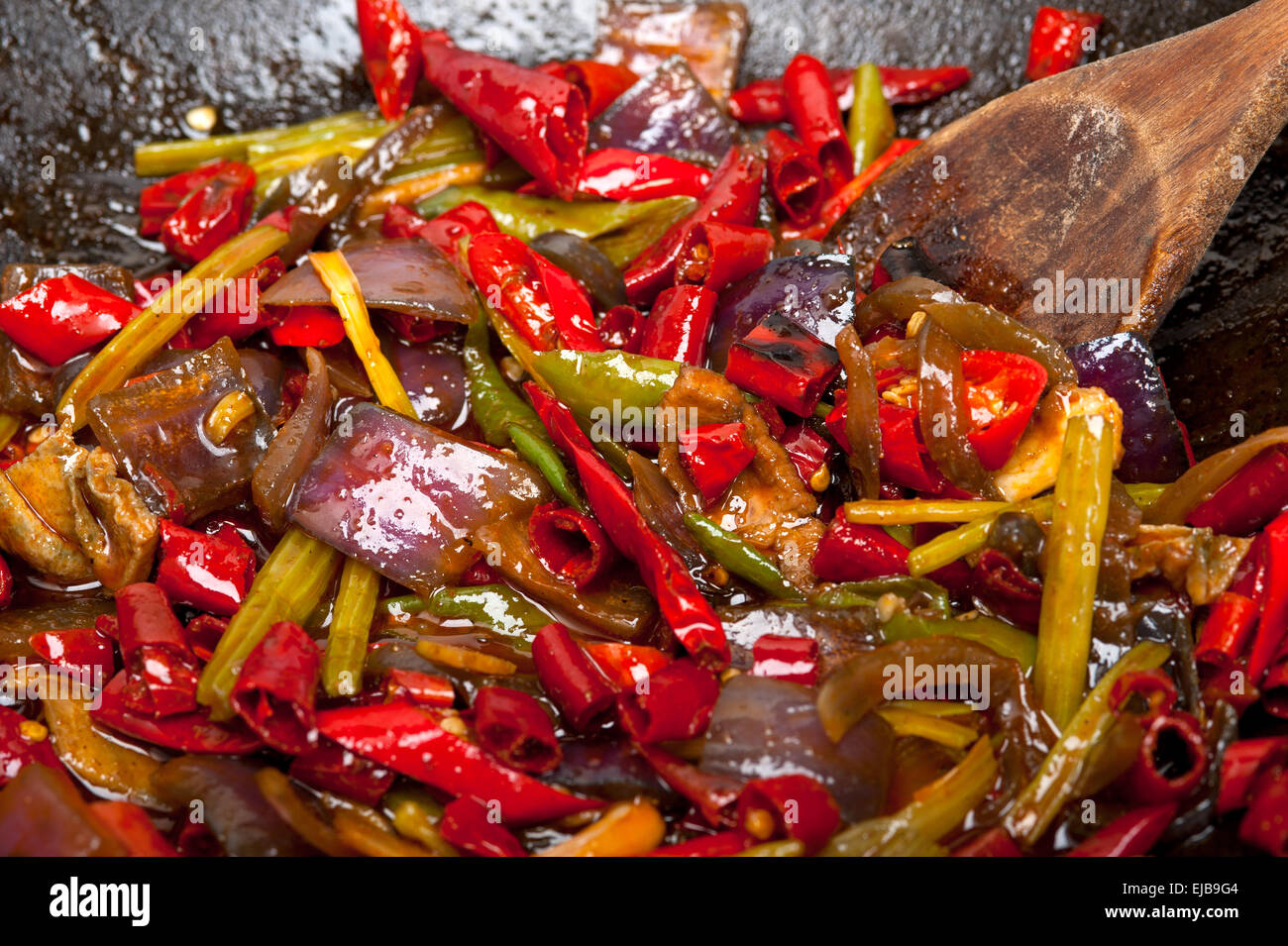 fried chili pepper and vegetable on a wok pan Stock Photo - Alamy