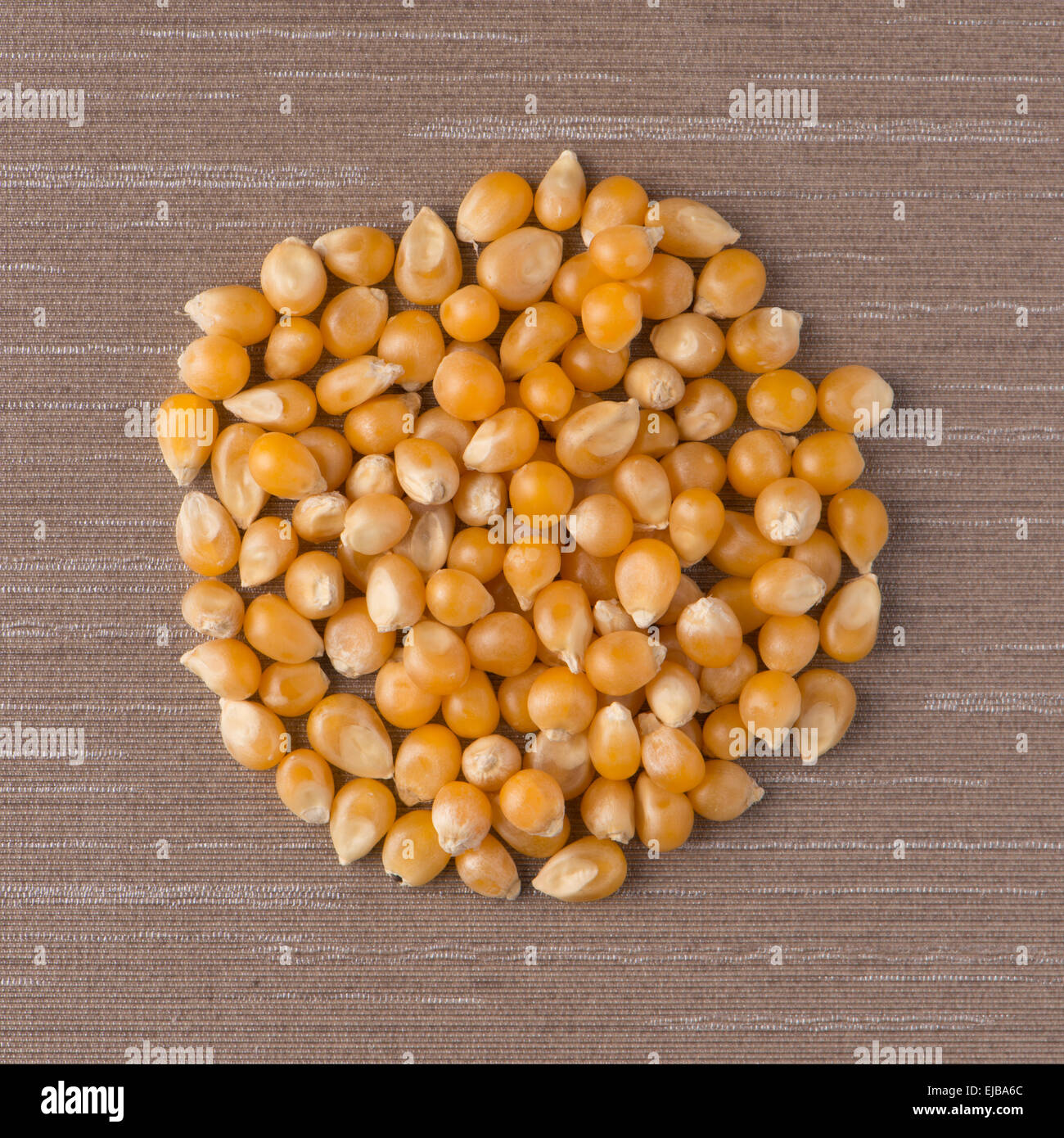Top view of circle of corn against beige vinyl background Stock Photo ...