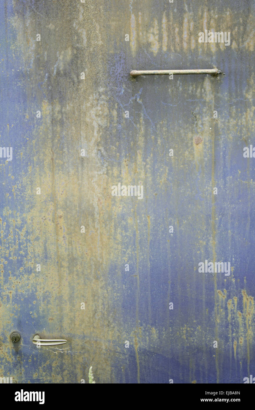 Rusty metal gate at the entrance of industrial building, construction ...