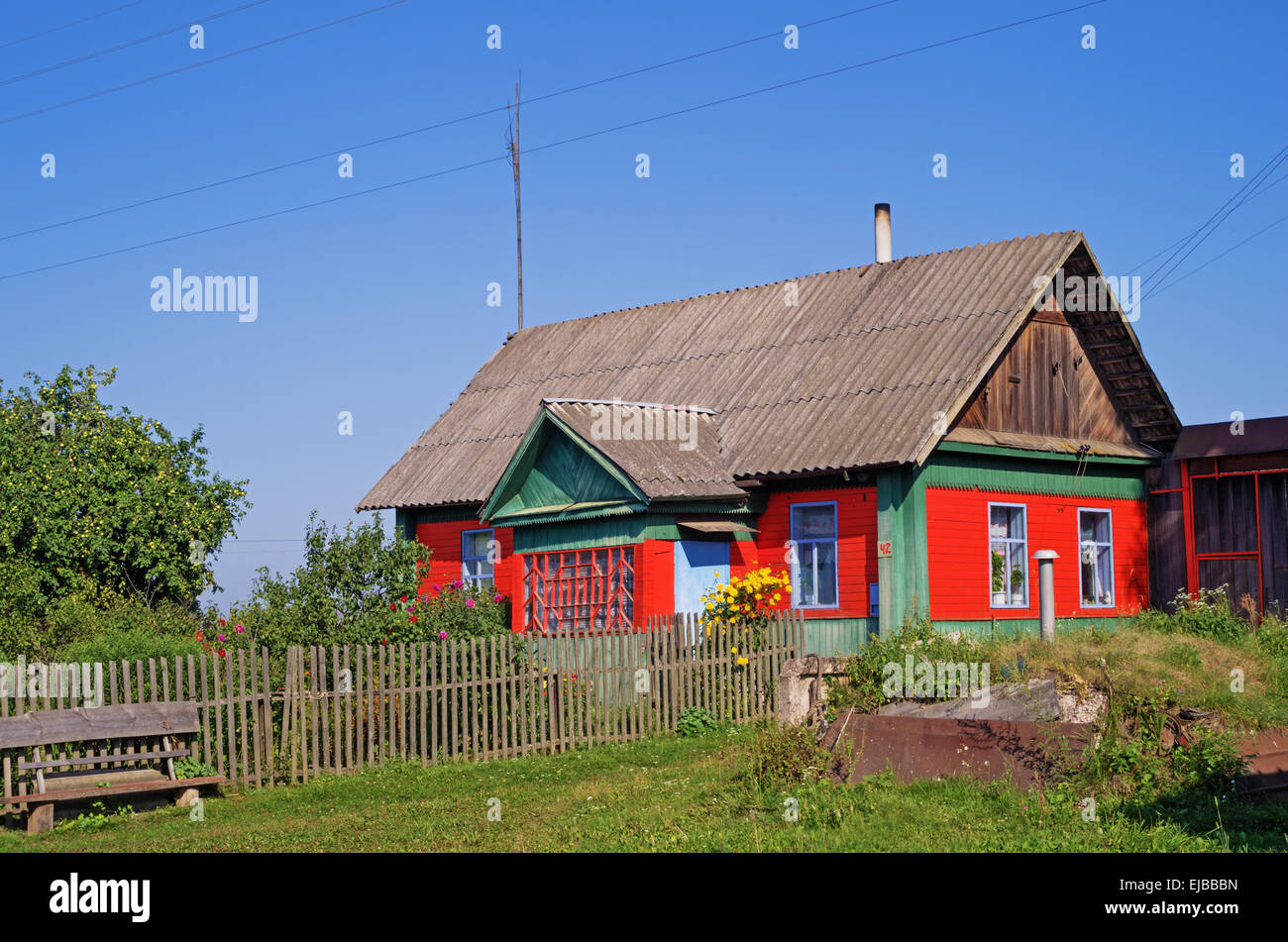 Rural landscape - red wooden house Stock Photo - Alamy