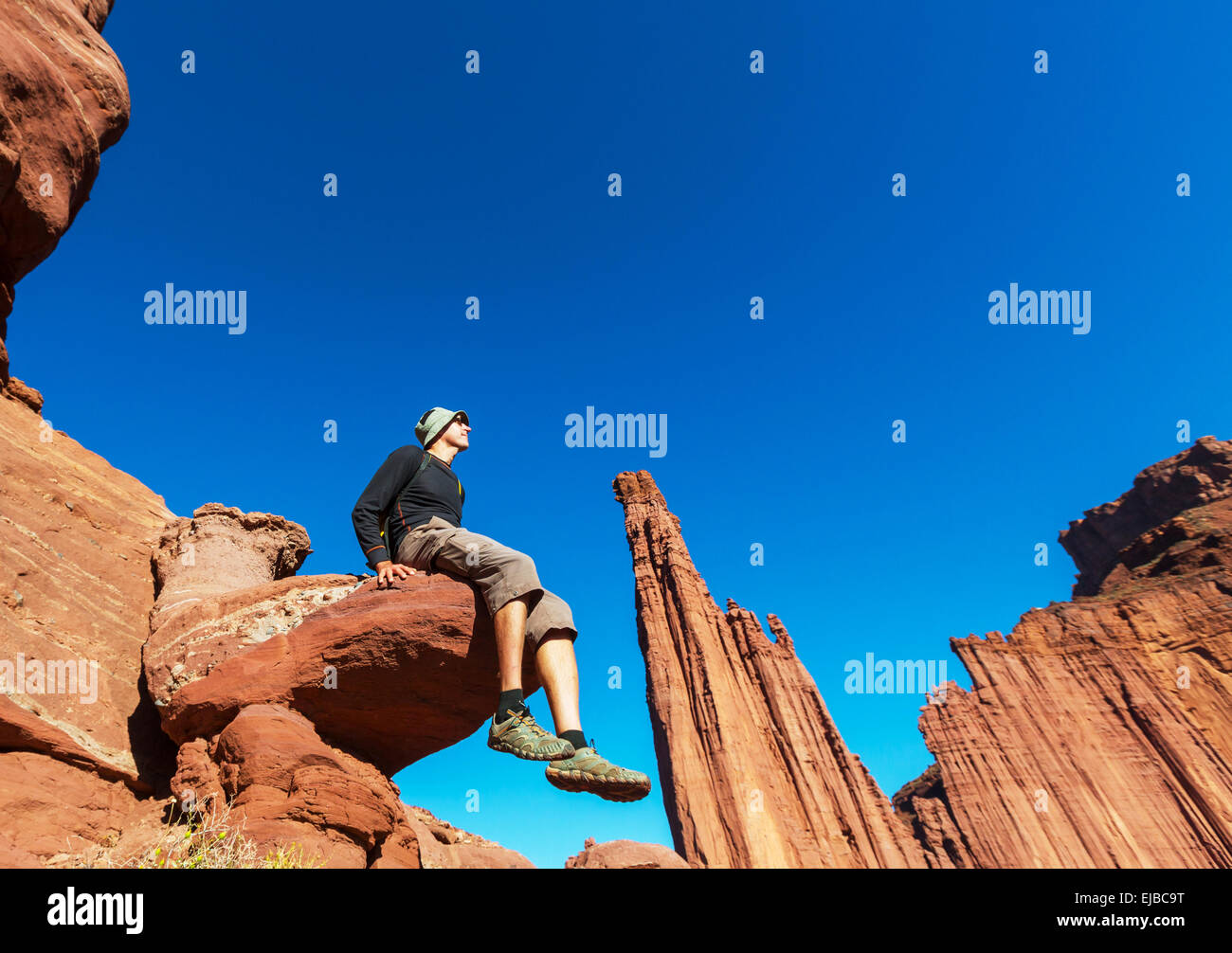 Man on the cliff Stock Photo - Alamy