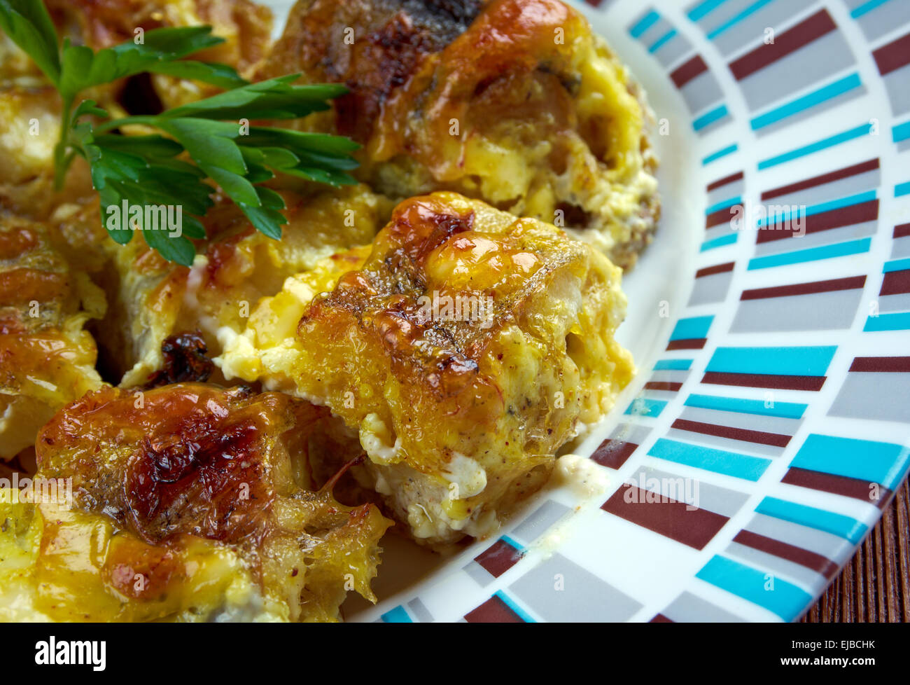 Fish dish - roasted fish Stock Photo - Alamy