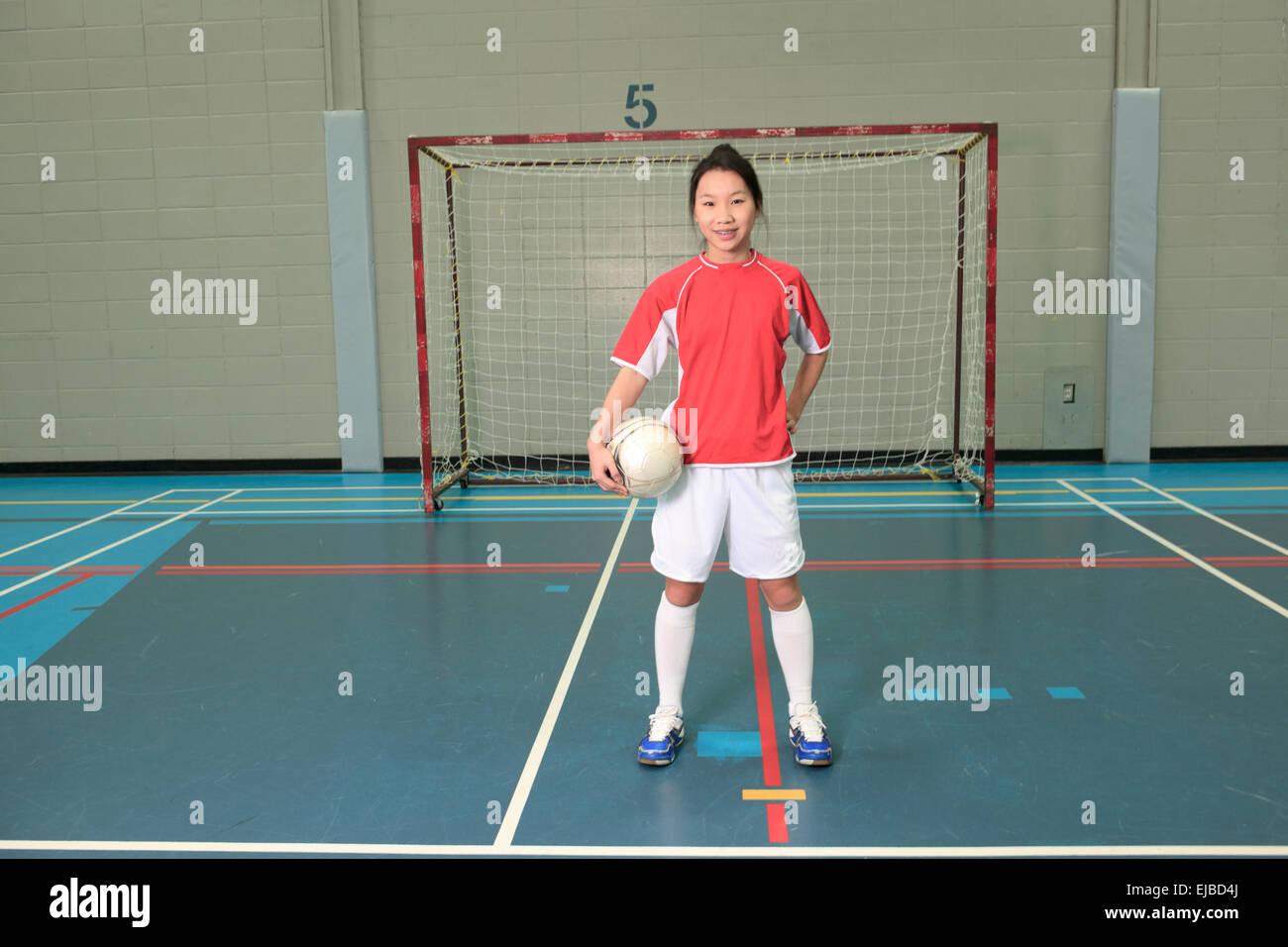 Female soccer player in a stadium Stock Photo - Alamy