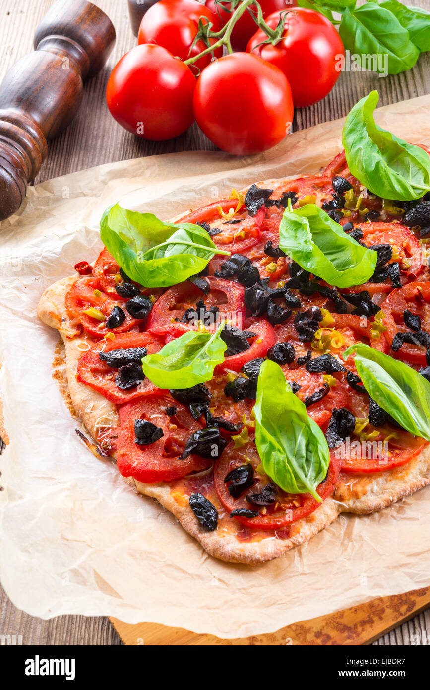 homemade olive - tomato pizza Stock Photo - Alamy