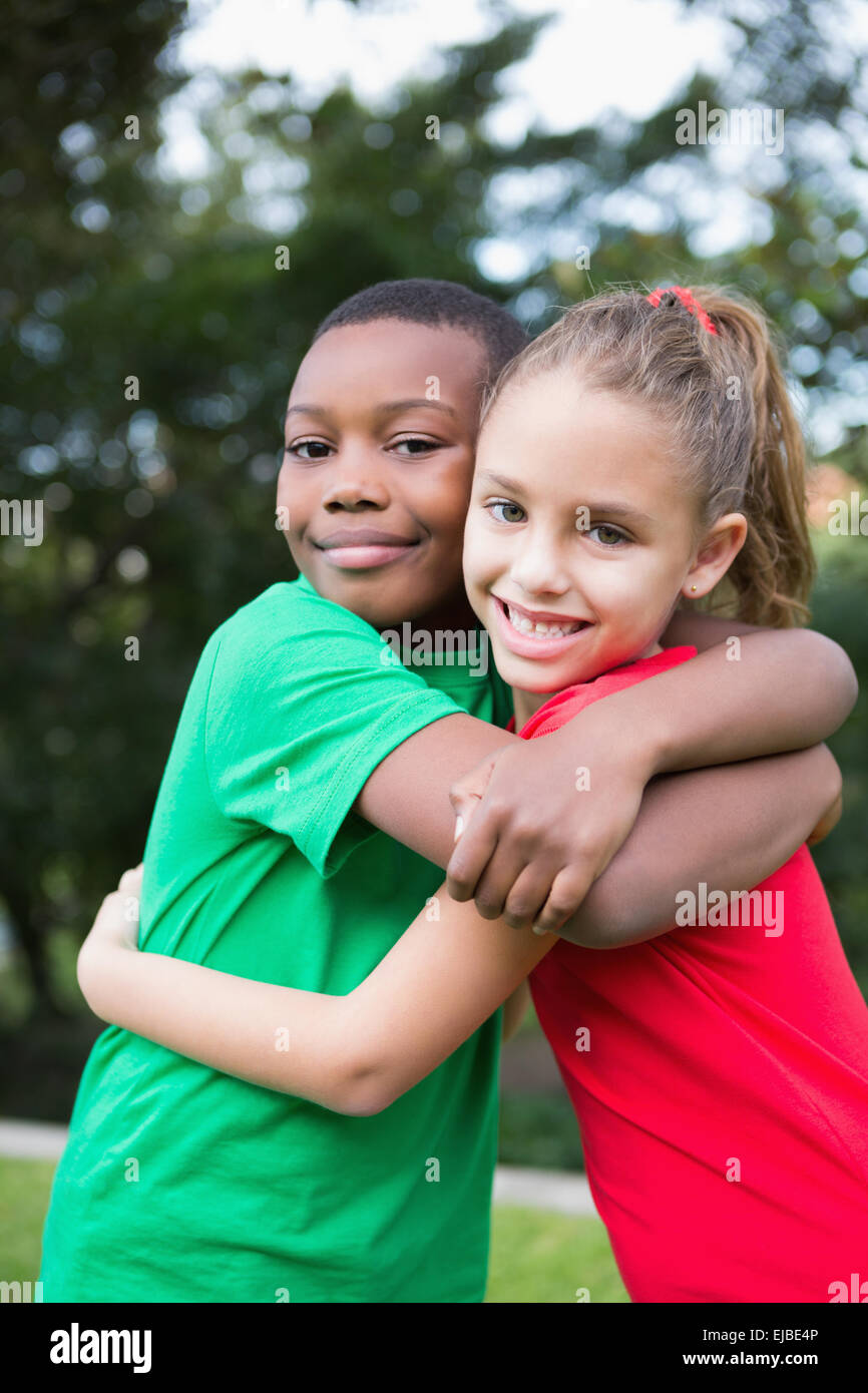 Cute children smiling at camera outside Stock Photo - Alamy