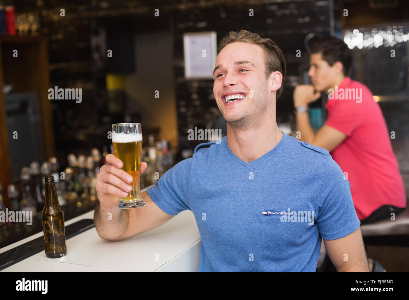 Man holding pint hi-res stock photography and images - Alamy