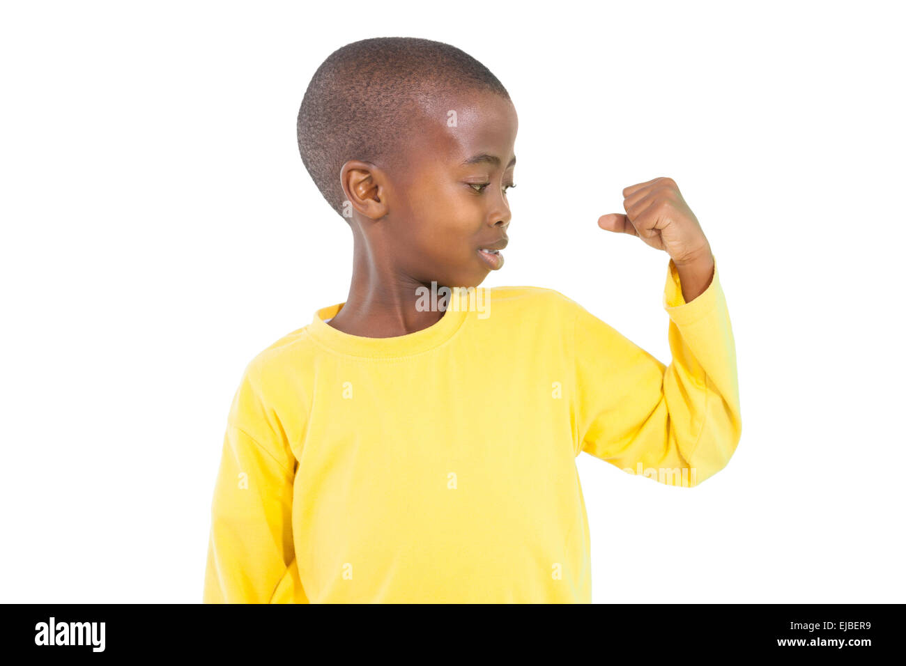 Happy little boy flexing arm Stock Photo - Alamy