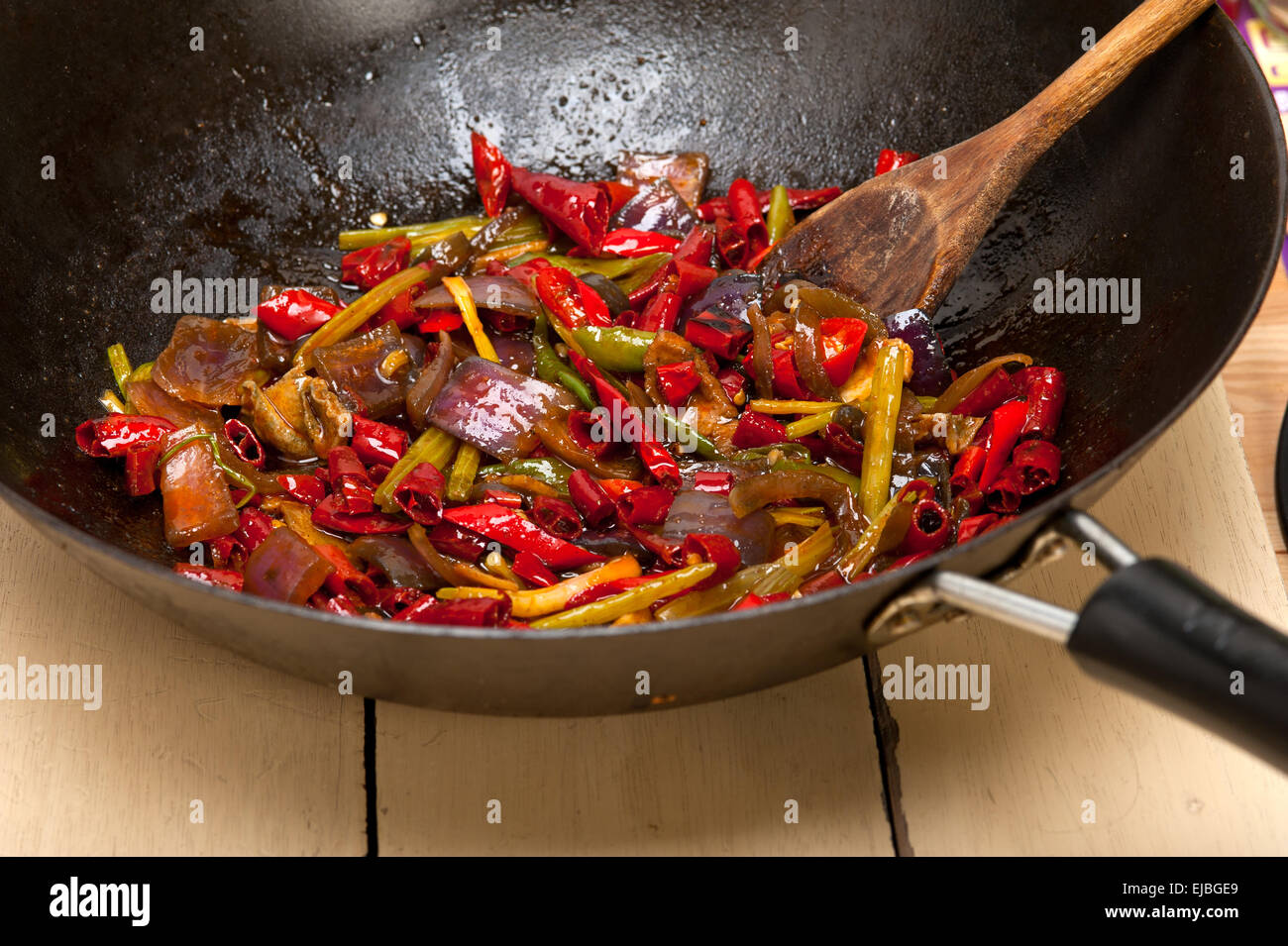 fried chili pepper and vegetable on a wok pan Stock Photo - Alamy