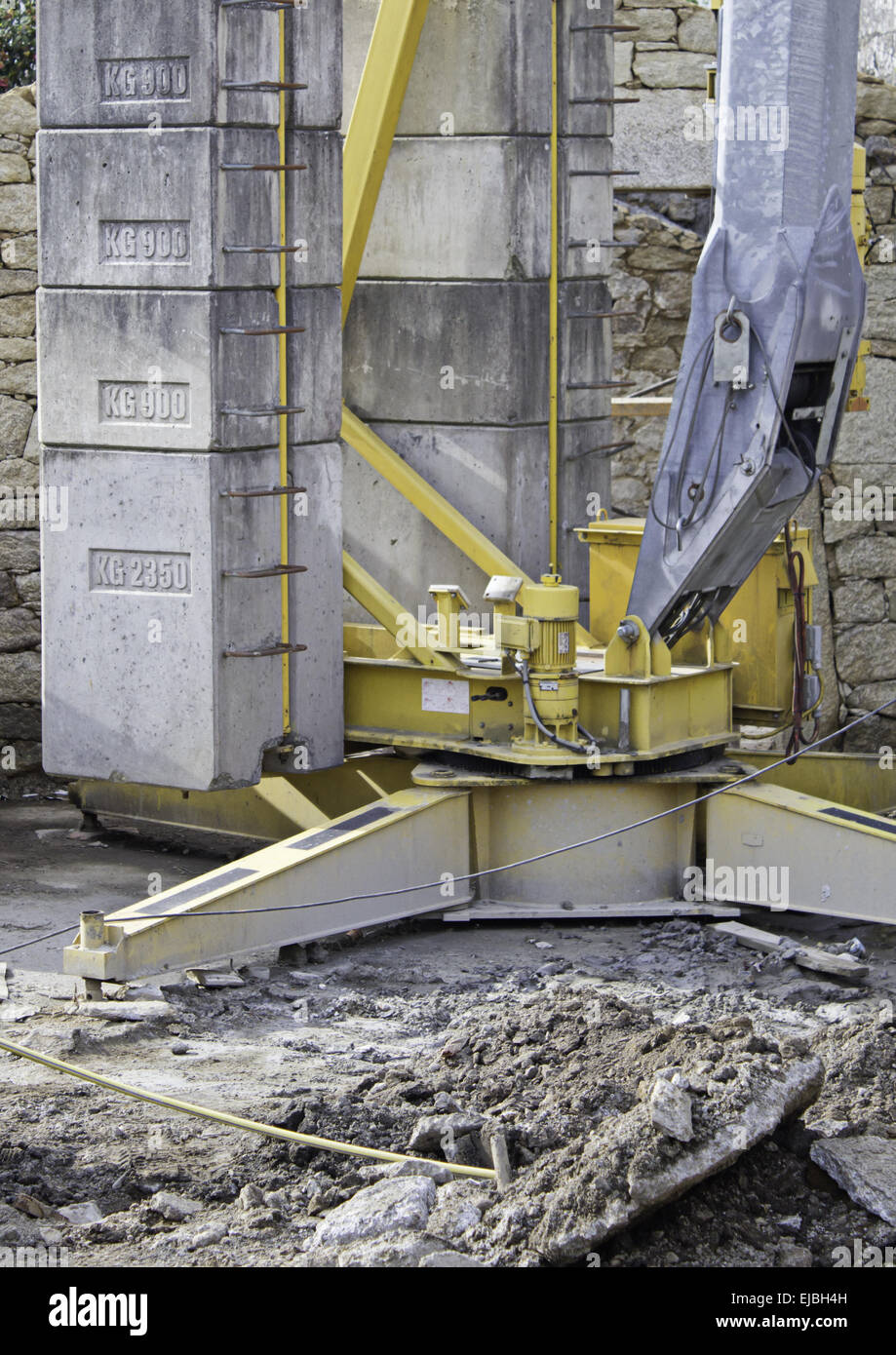 Construction equipment with weights on ground stone, architecture and ...