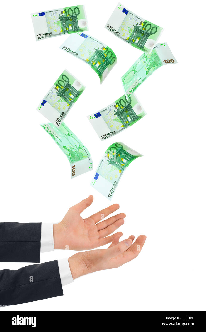 Hand and falling money Stock Photo - Alamy