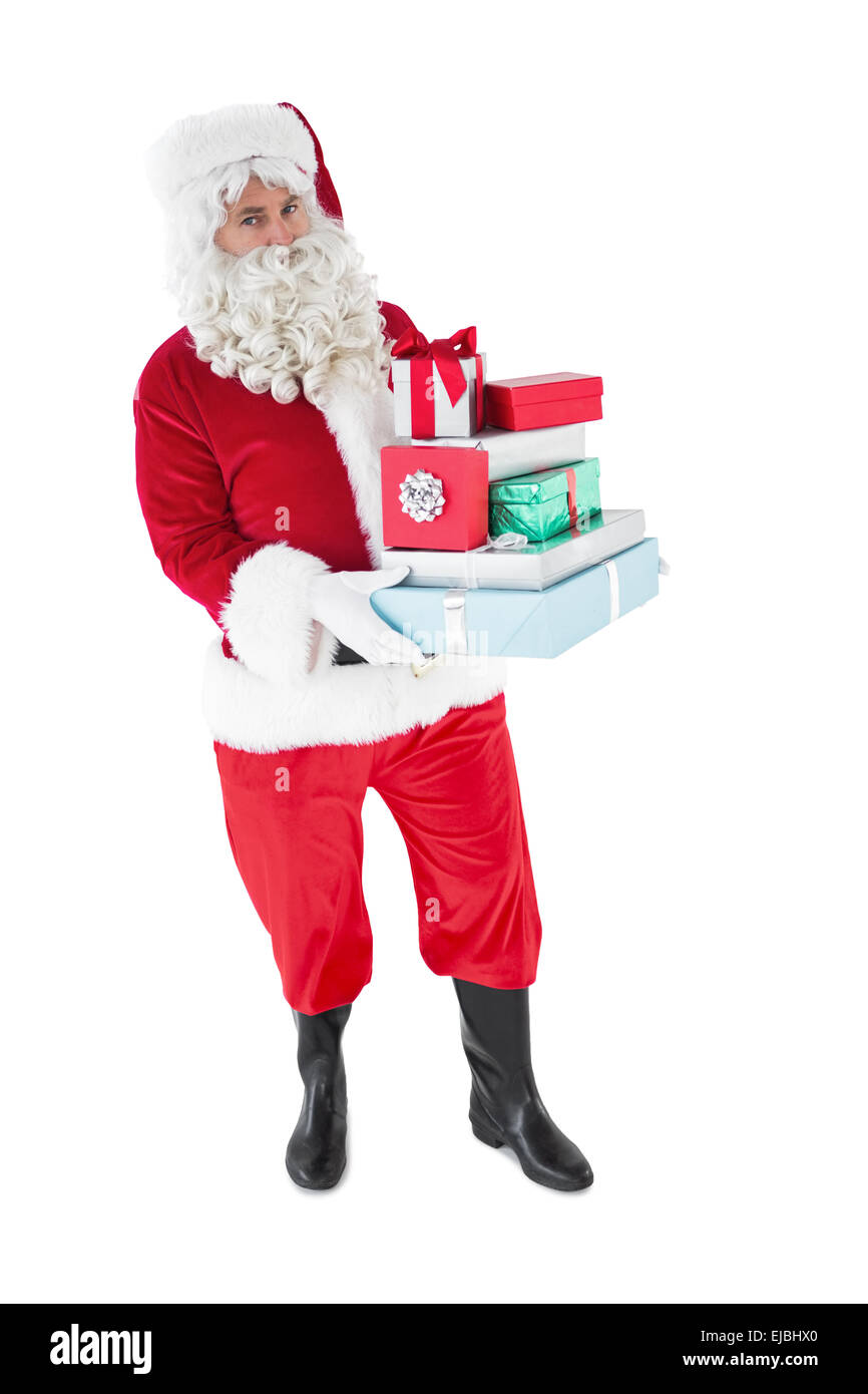 Father christmas holding many gifts Stock Photo - Alamy