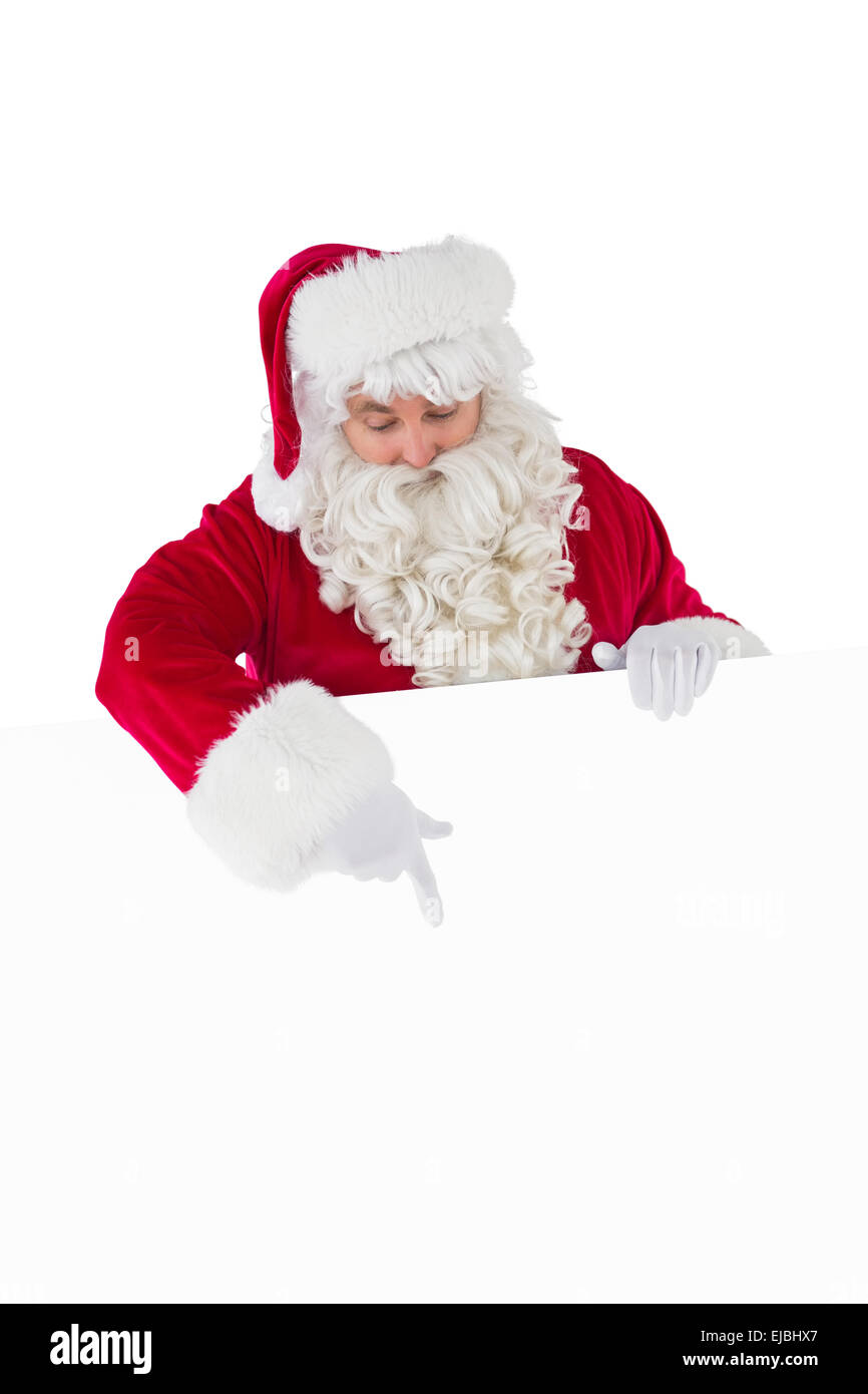 Cheerful santa claus presenting sign Stock Photo - Alamy