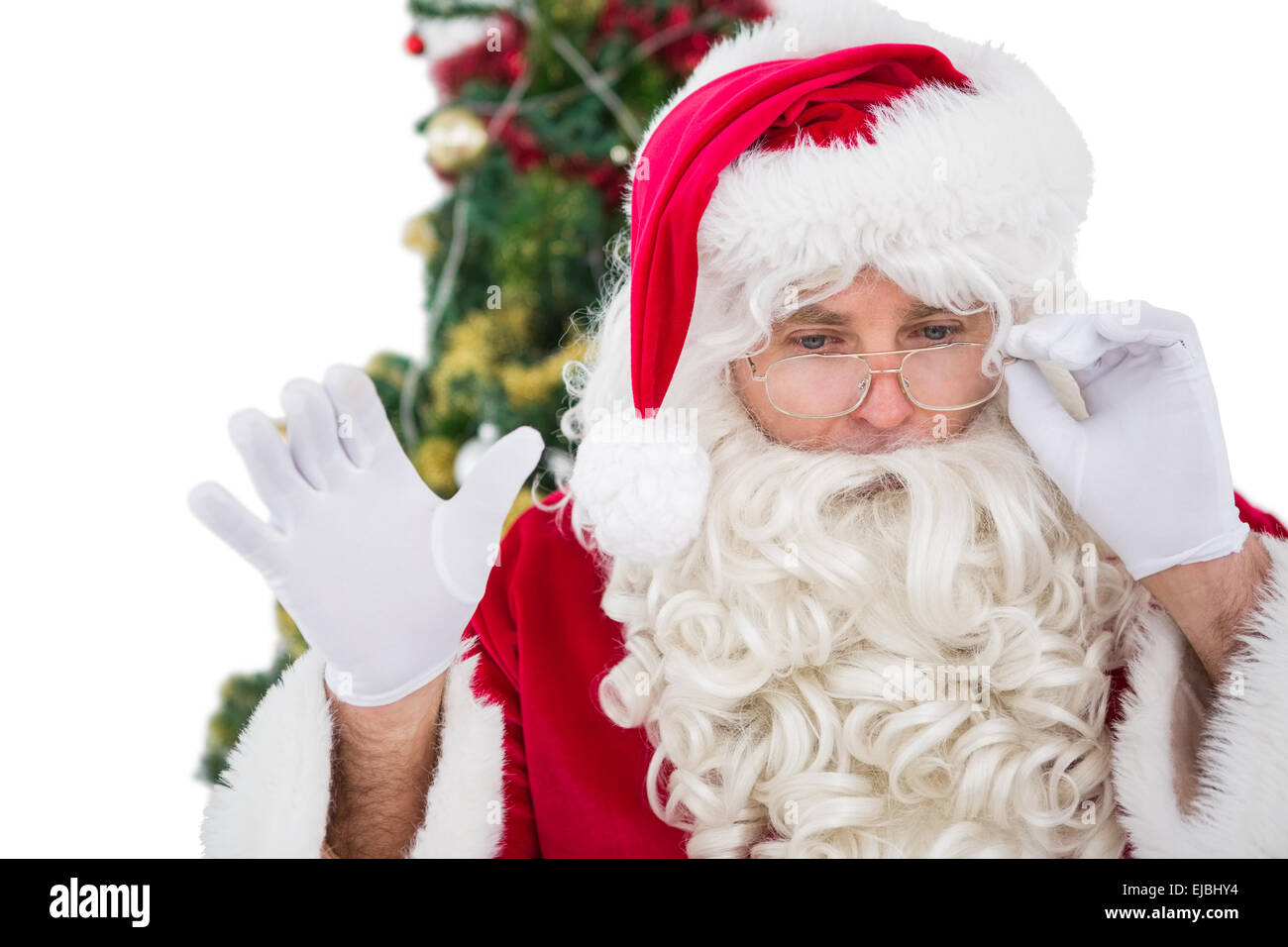 Concentrated santa claus doing gesture Stock Photo - Alamy