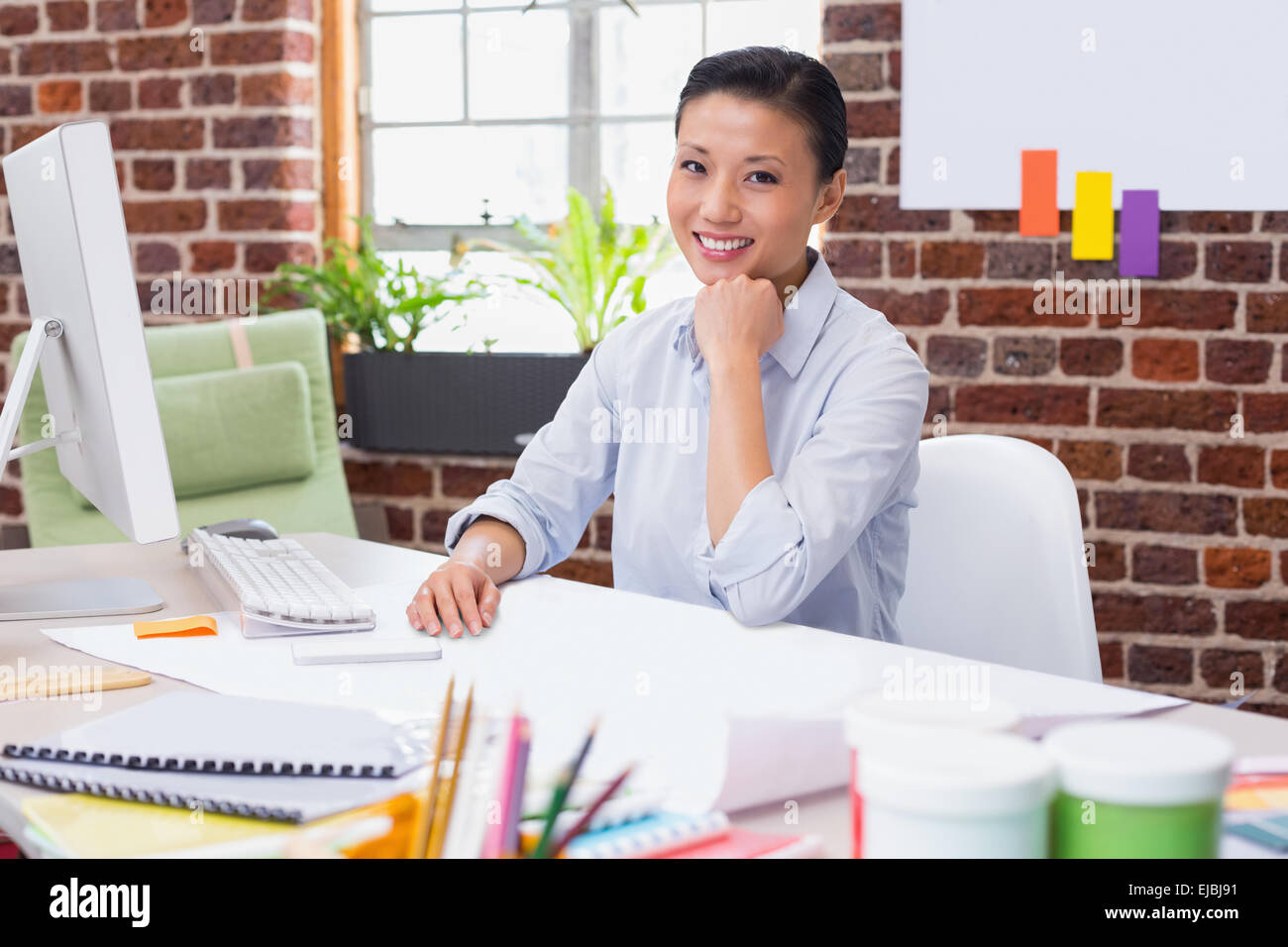 Portrait female executive desk hi-res stock photography and images - Alamy