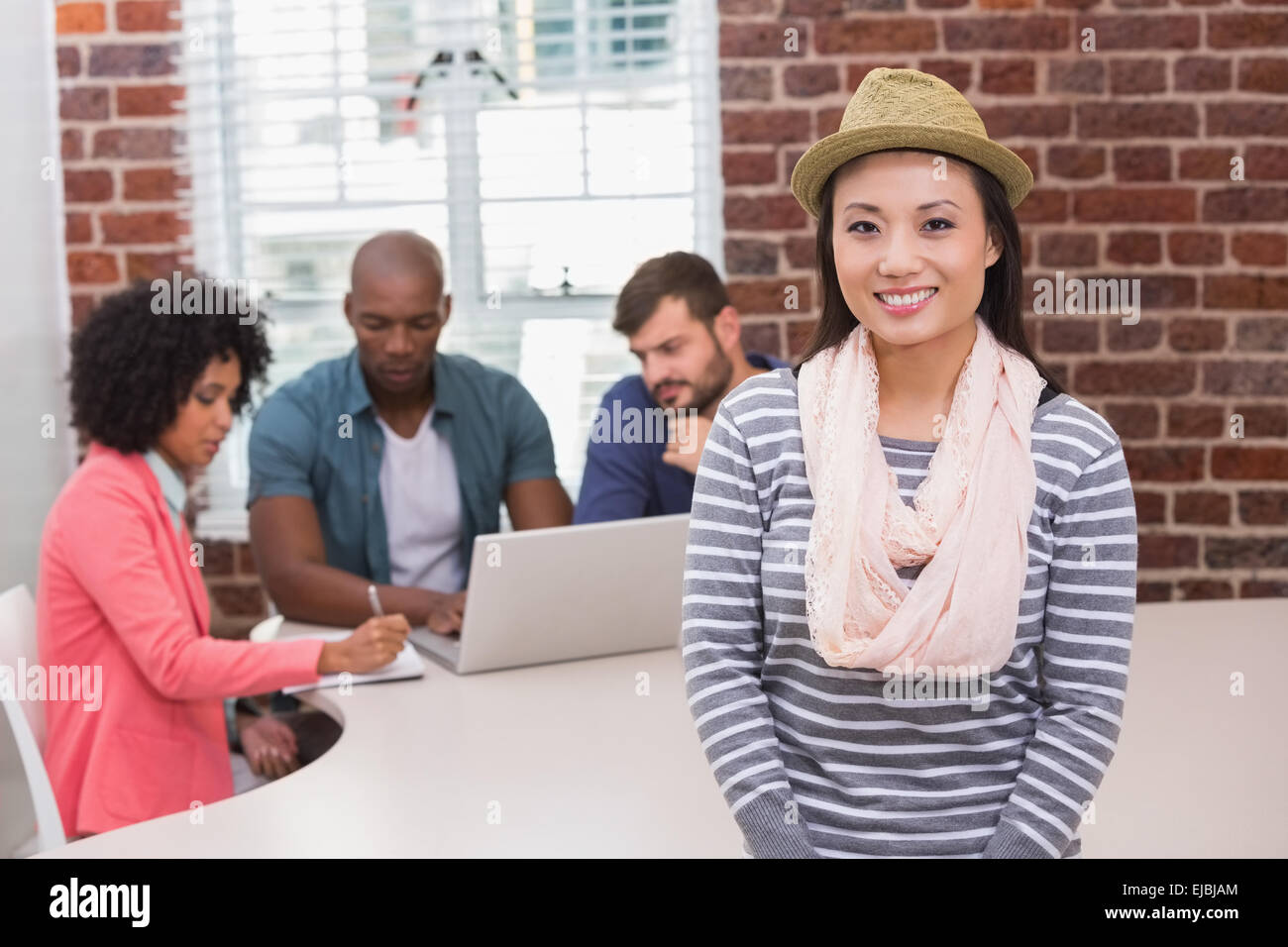 Mid adult woman working behind hi-res stock photography and images - Alamy