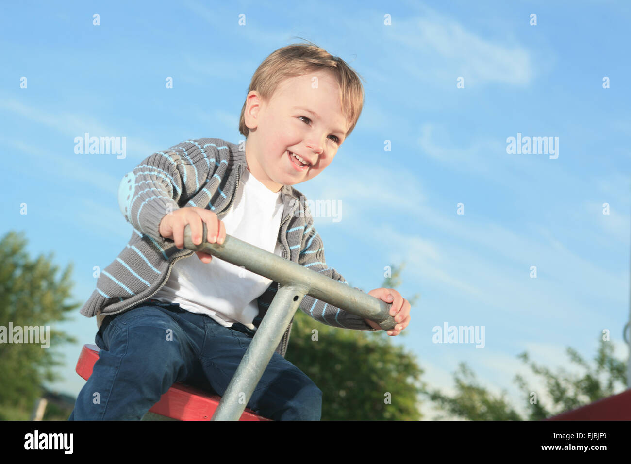 A nice kid playing in the playground Stock Photo - Alamy