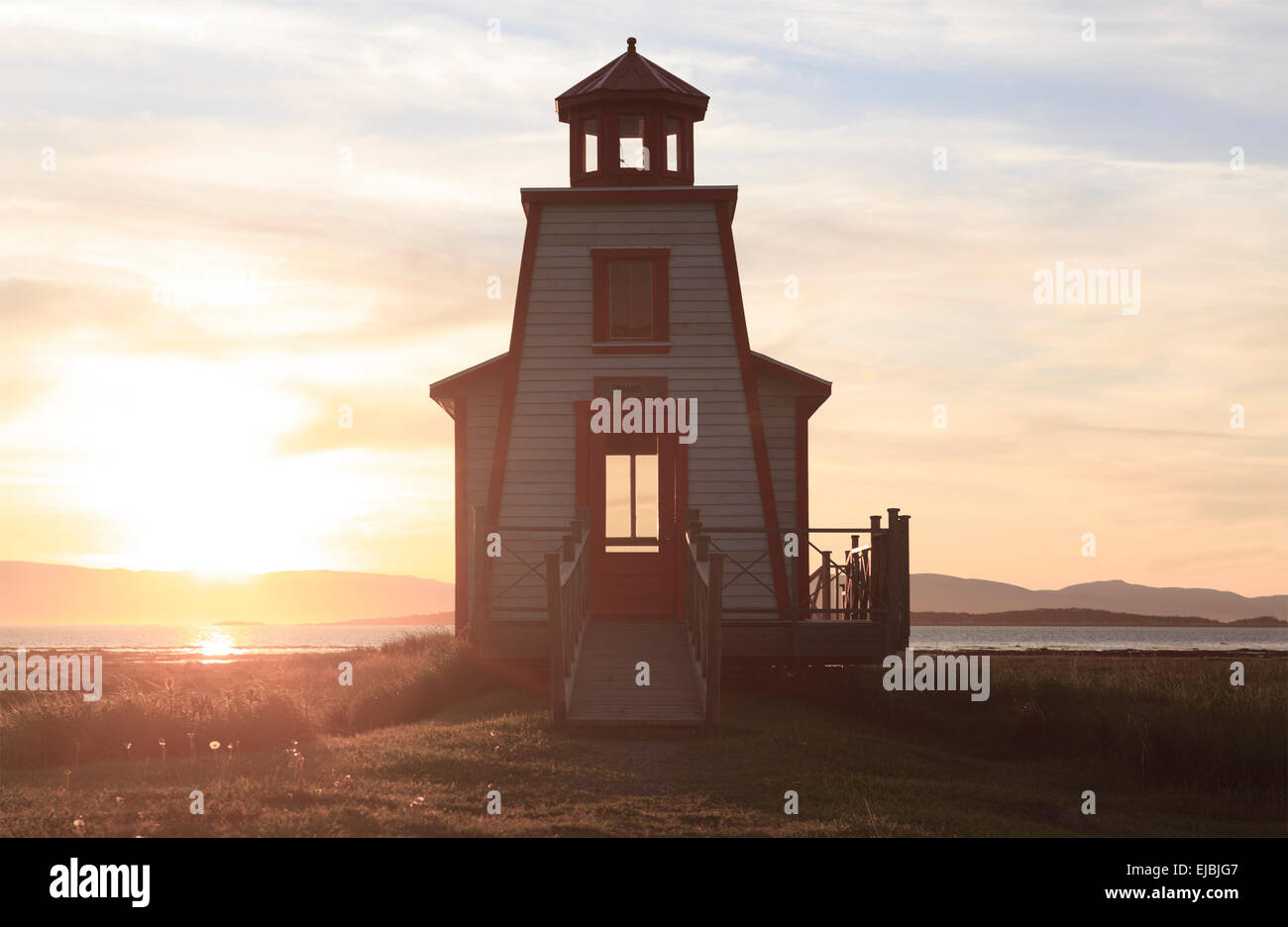 A beautiful lighthouse on a sunset background Stock Photo - Alamy