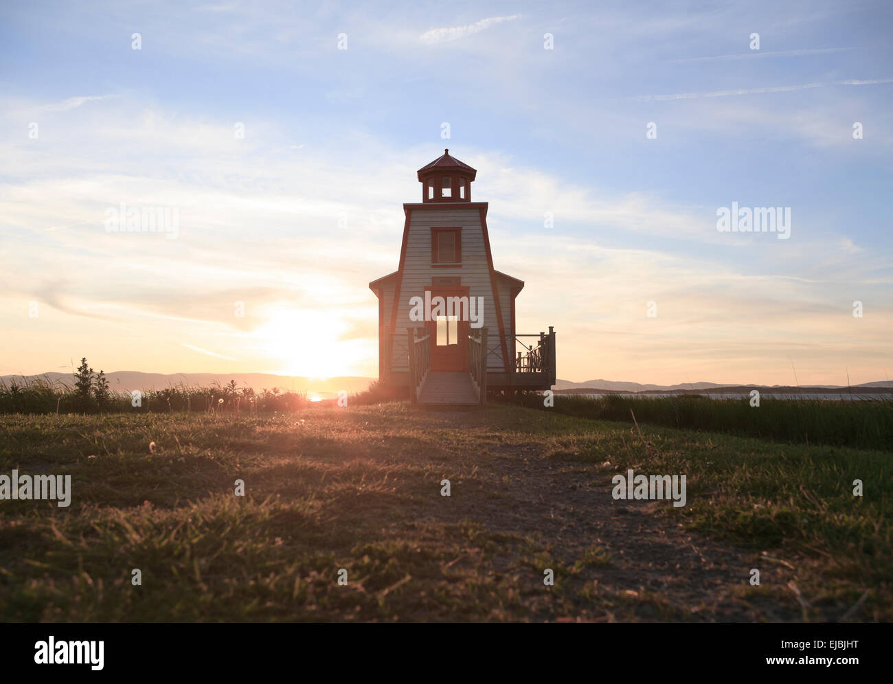 A beautiful lighthouse on a sunset background Stock Photo - Alamy