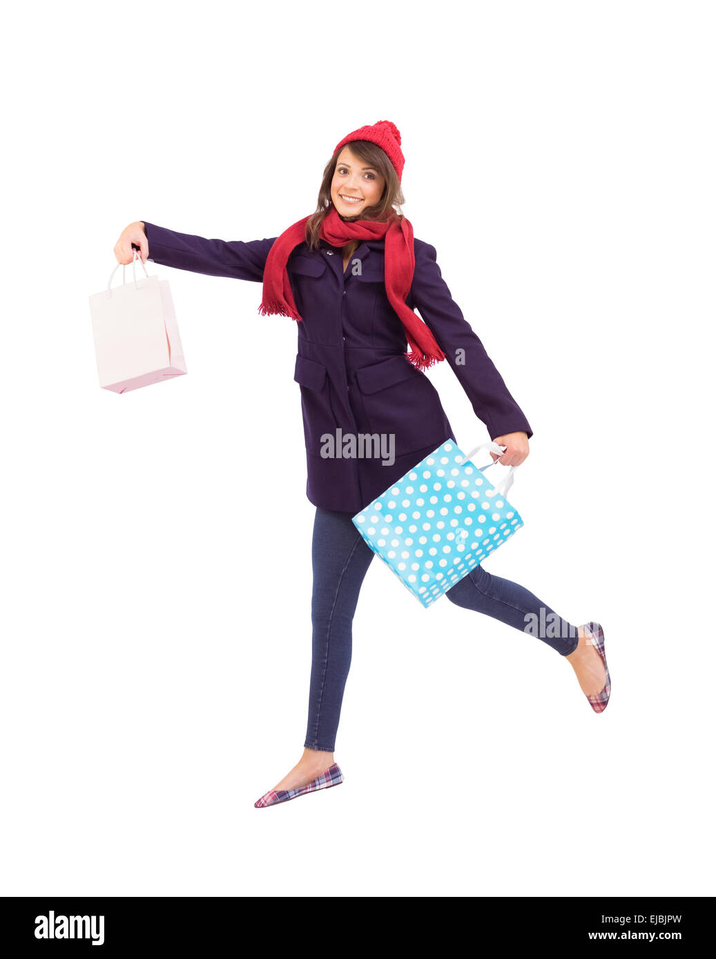 Woman carrying shopping bags jumping hi-res stock photography and ...