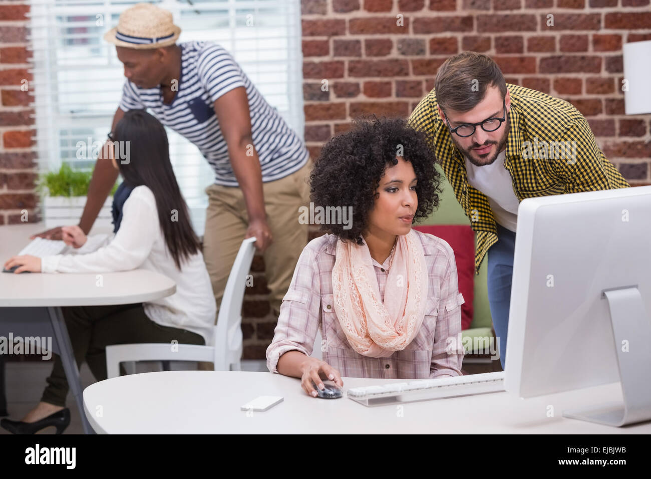 Creative business people using computer Stock Photo - Alamy