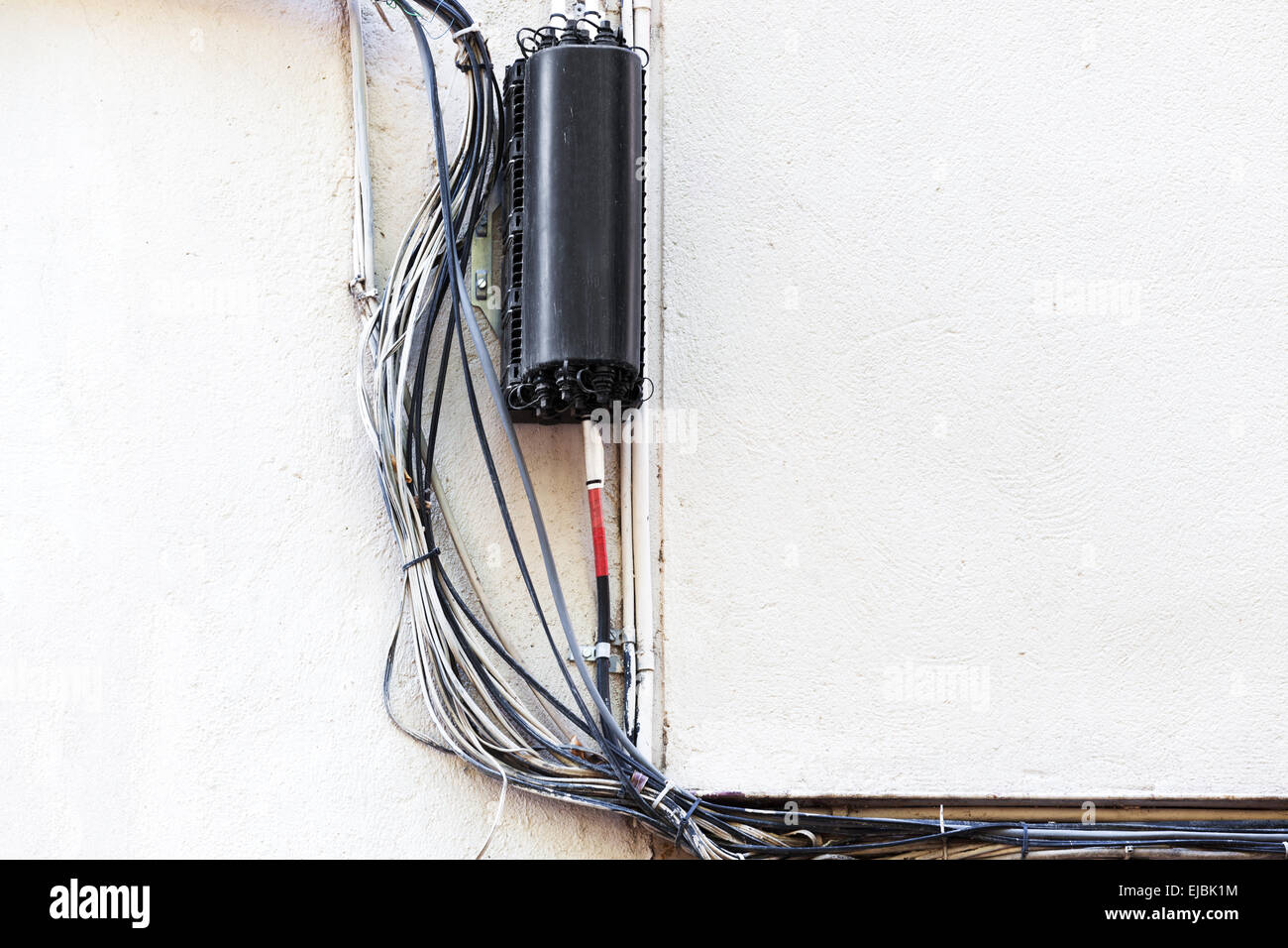 wires on a white wall Stock Photo - Alamy