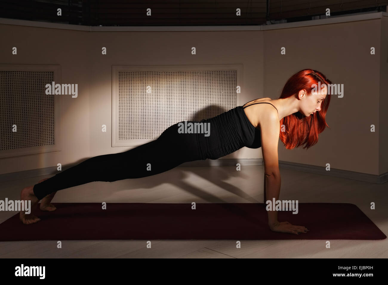 Redhead in yoga class Stock Photo - Alamy