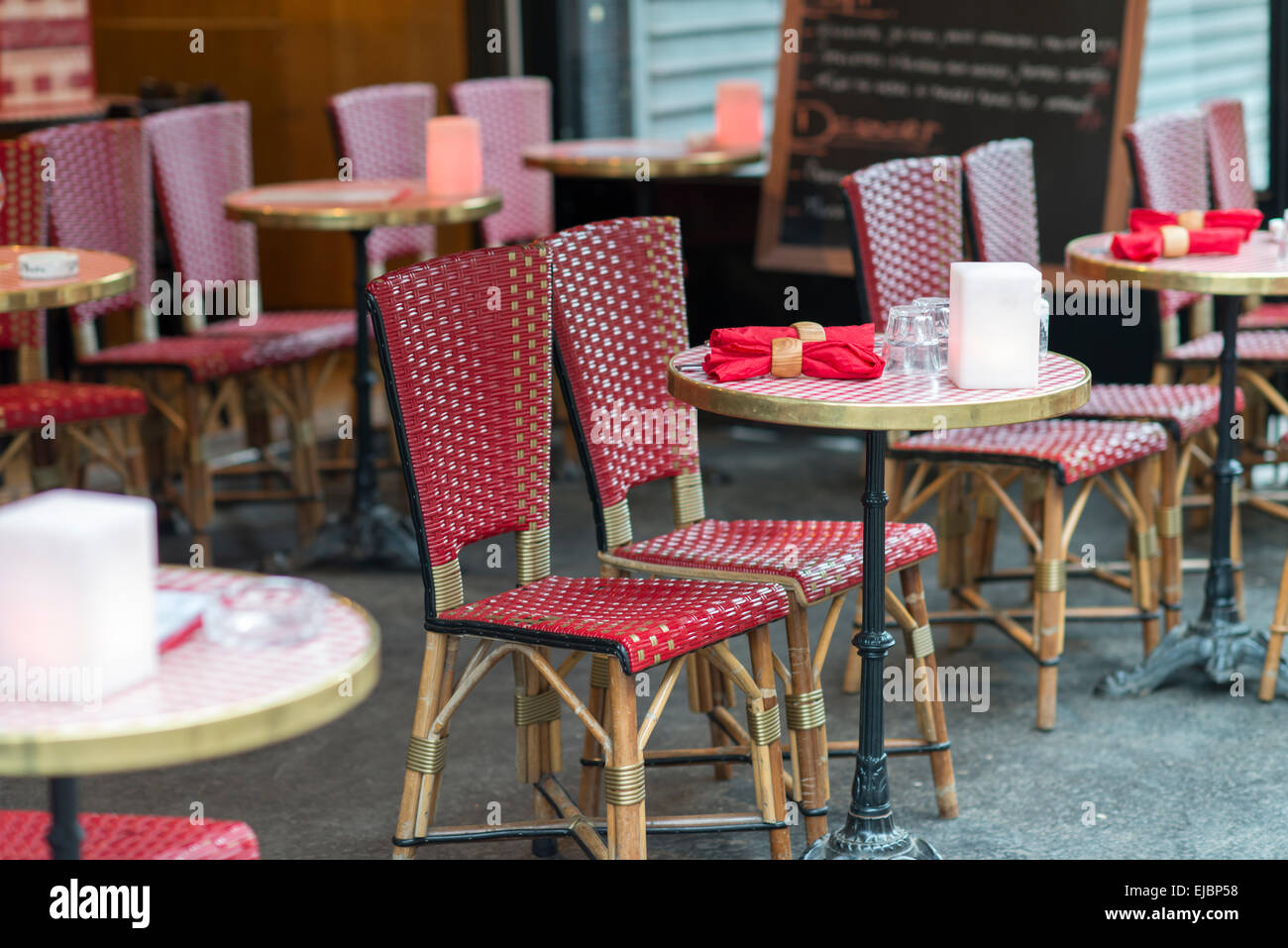 Sidewalk cafe chairs in Paris, France Stock Photo - Alamy