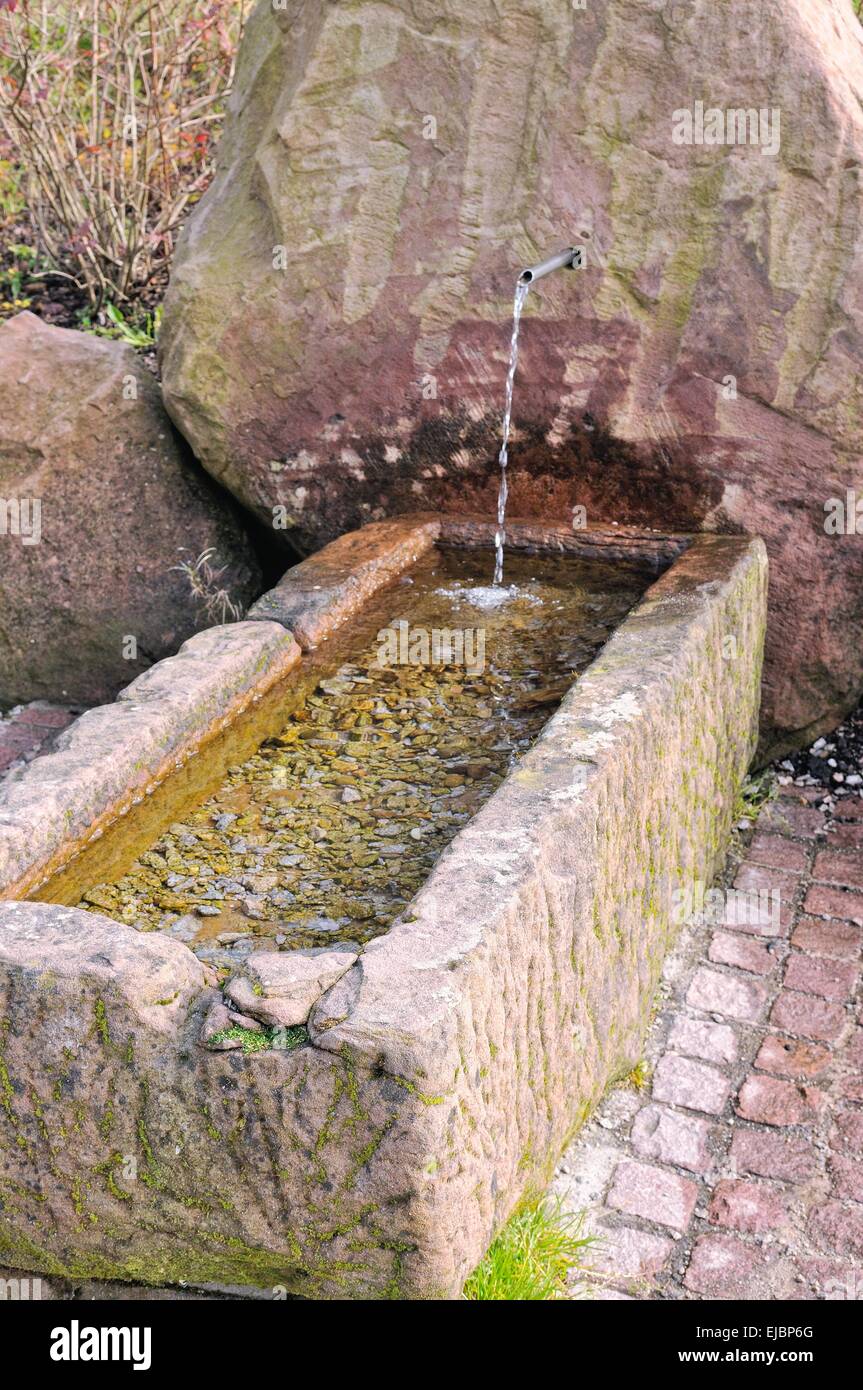 Water fountain made of sandstone Stock Photo - Alamy