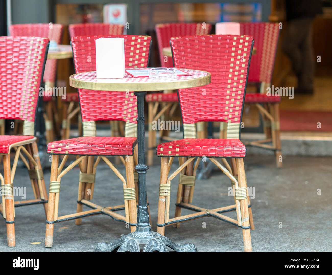 Sidewalk cafe chairs in Paris, France Stock Photo - Alamy