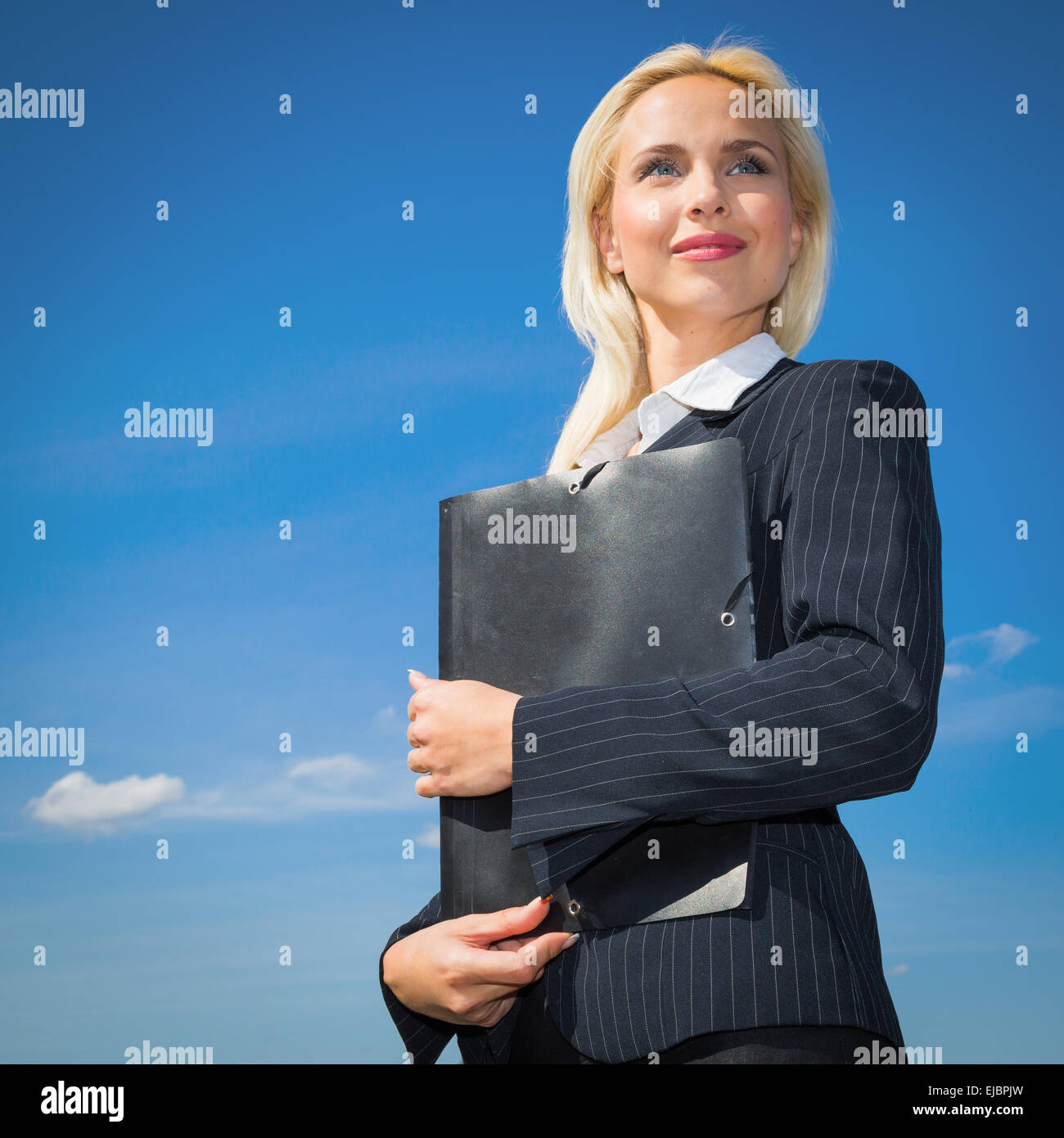 business woman on background of sky Stock Photo - Alamy