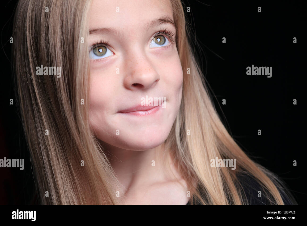 young girl poses for a picture isolated on black Stock Photo - Alamy young girl poses for a picture isolated on black Stock Photo - Alamy