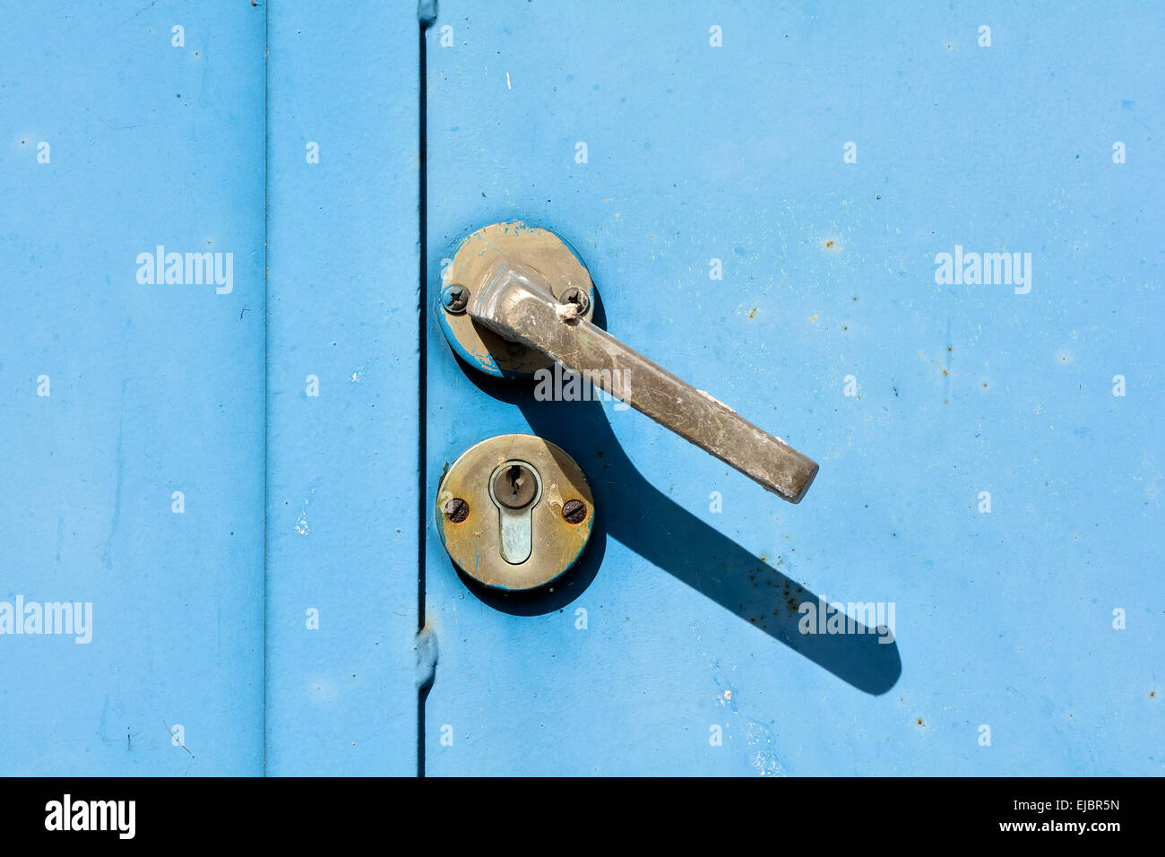 Blue locked door Stock Photo - Alamy