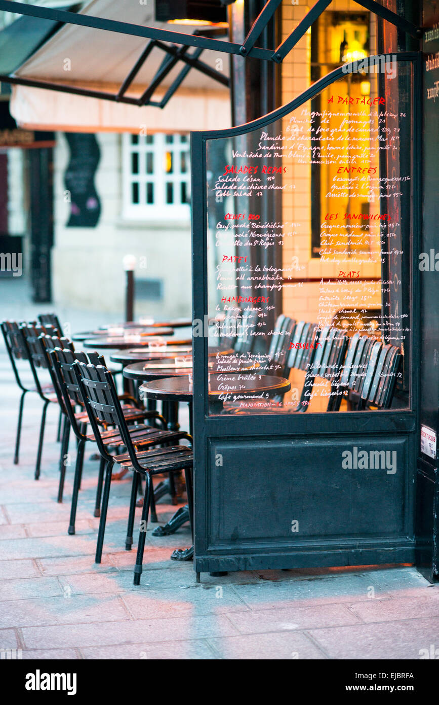 Sidewalk cafe chairs in Paris, France Stock Photo - Alamy