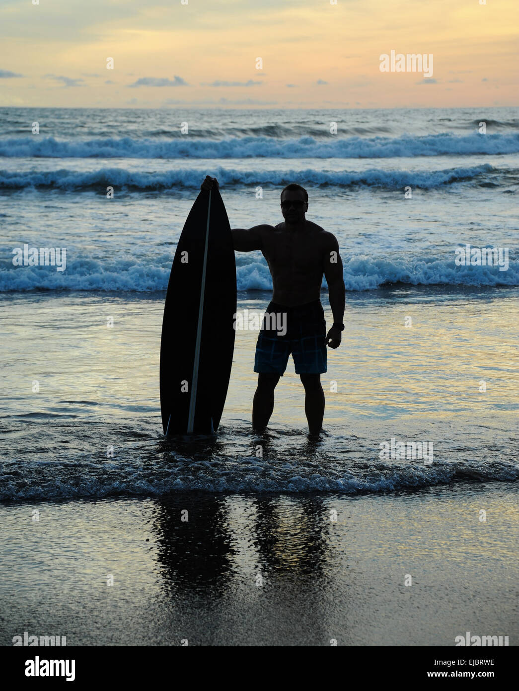 Surfer with board Stock Photo - Alamy