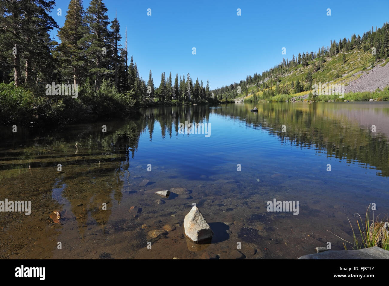 Shallow Mammoth Lake among pine forests Stock Photo - Alamy